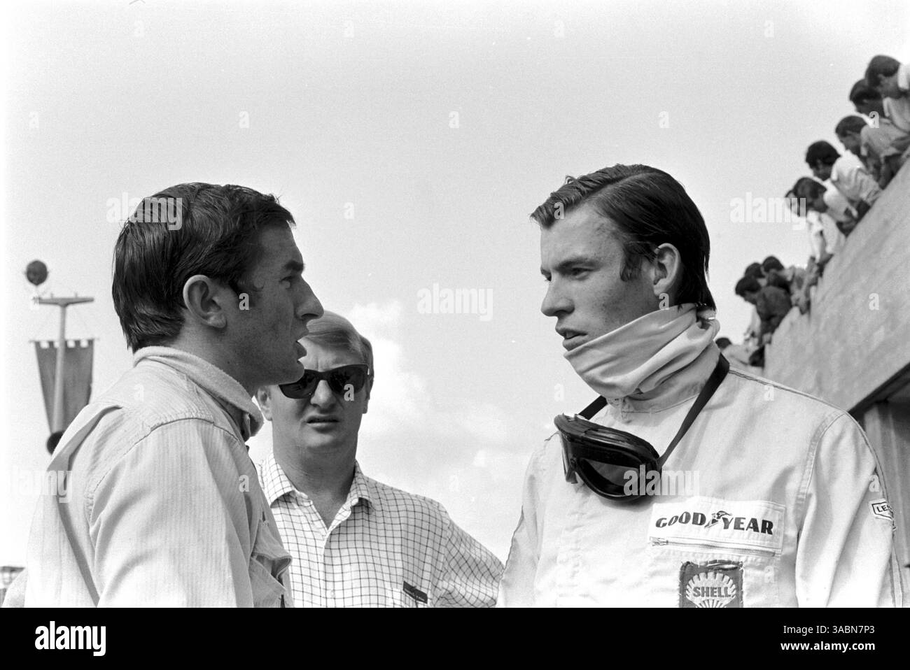 Chris Irwin (GBR) BRM P83 (right) talking with Jackie Stewart (left ...