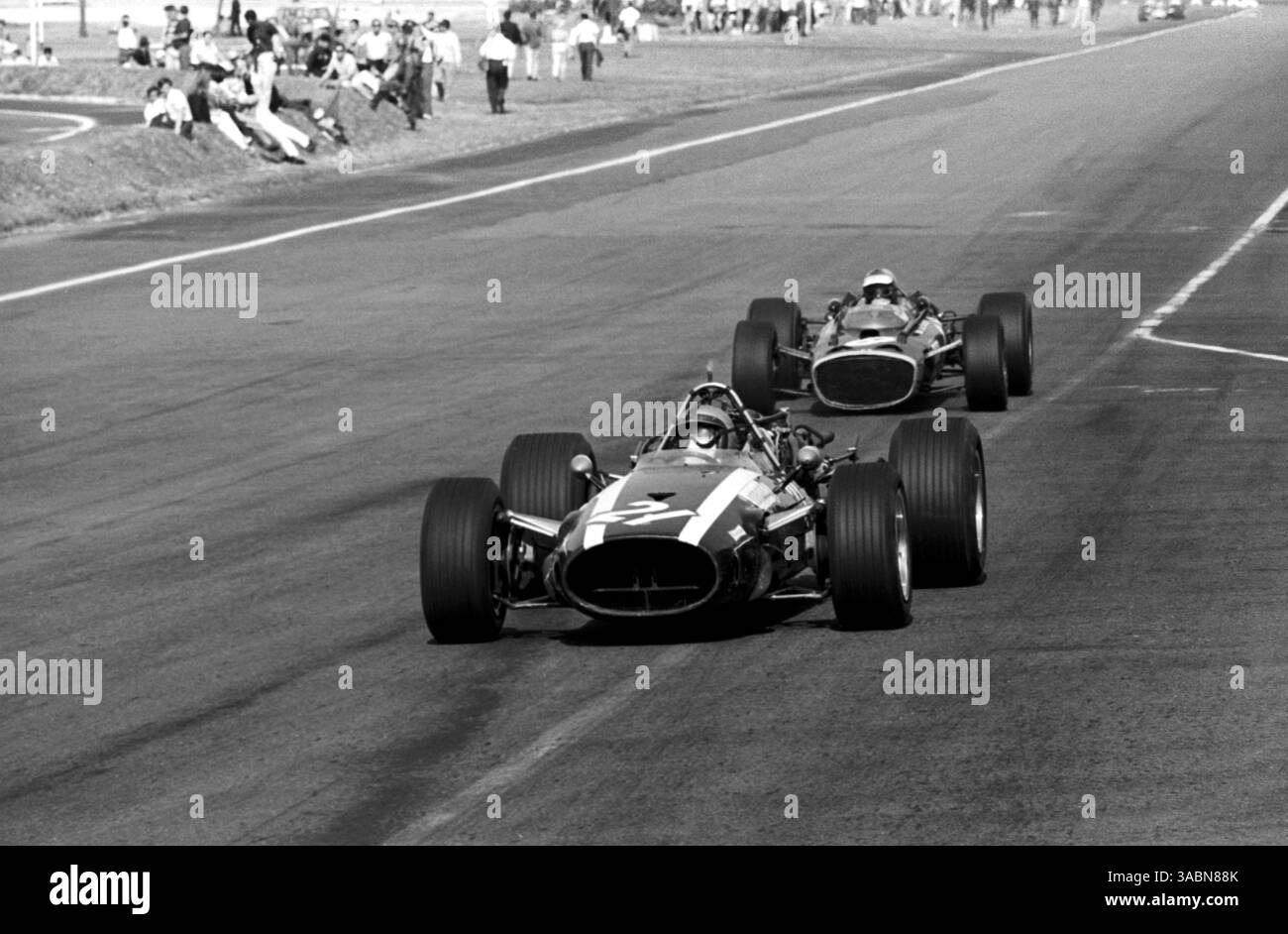 Sixth placed Pedro Rodriguez (MEX) Cooper T81B leads Mike Spence (GBR ...