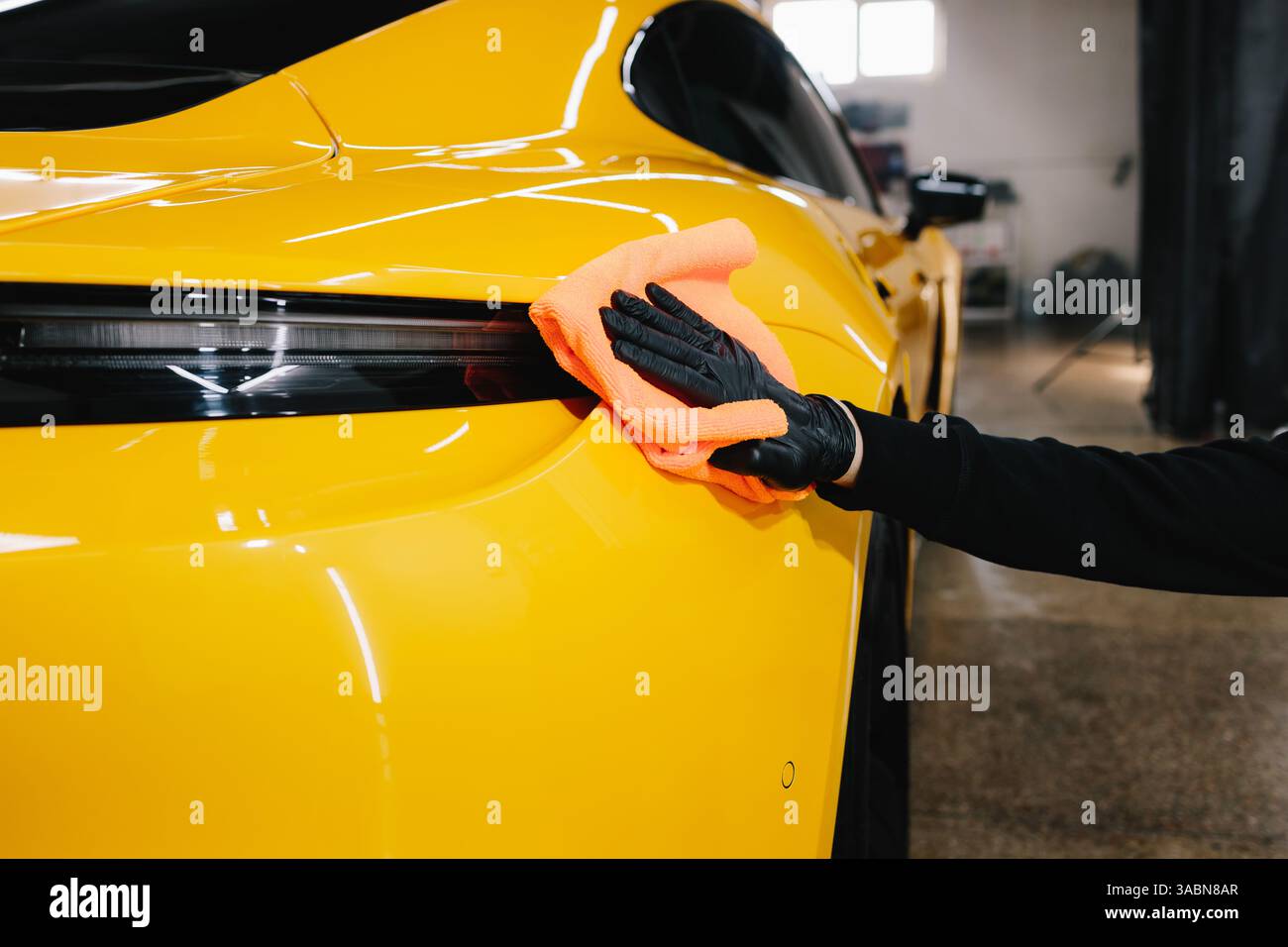 Manual washing and polishing car with microfiber cloth after detailing ...