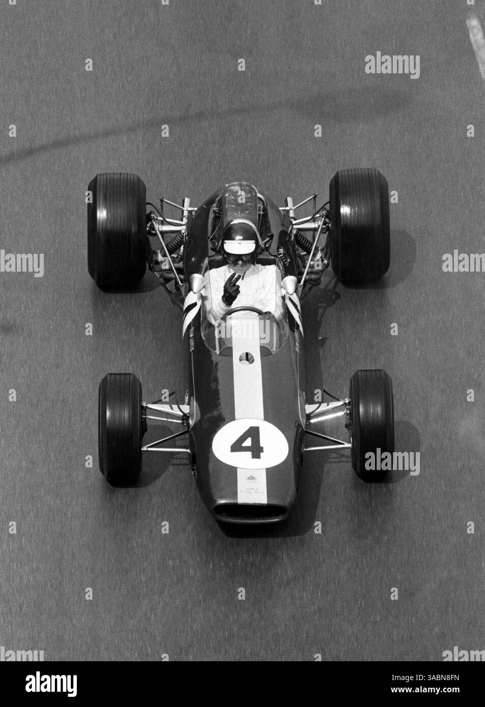 Jim Clark (GBR) Lotus 33 gives a message of support to the photographer! ..Monaco Grand Prix ...