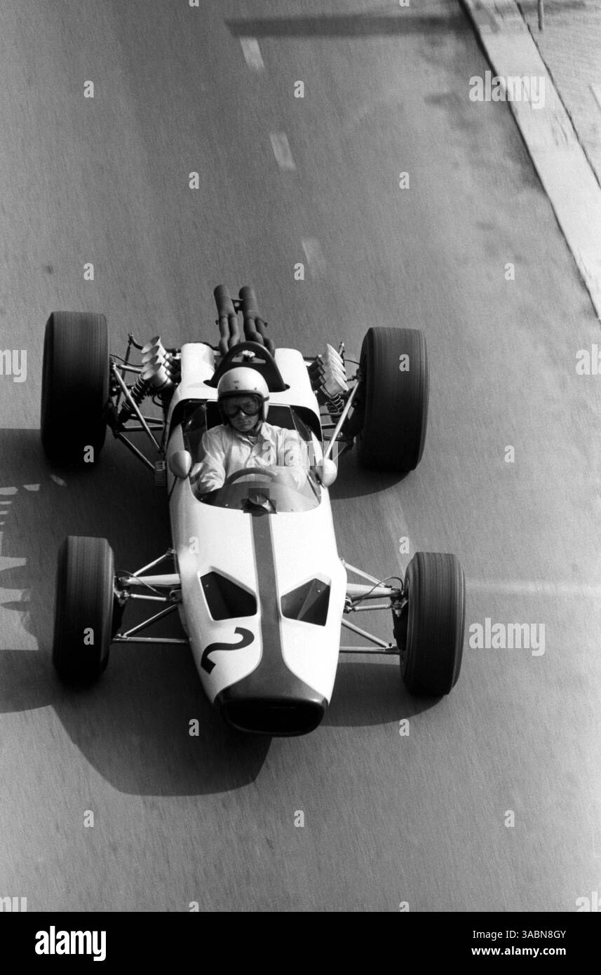 Bruce McLaren (NZL) retired from the race on lap nine with an oil leak ...