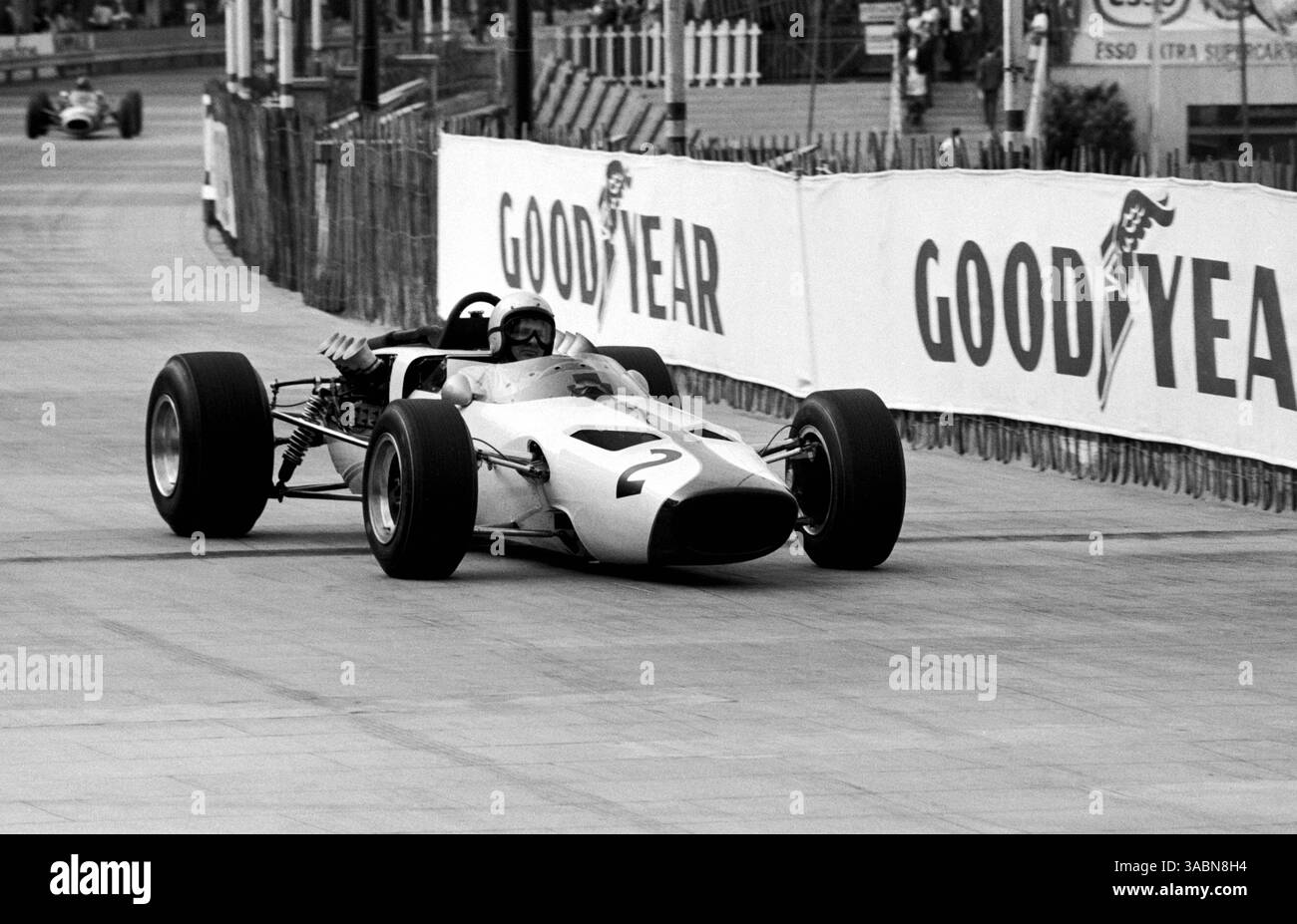 Bruce McLaren (NZL) retired from the race on lap nine with an oil leak ...