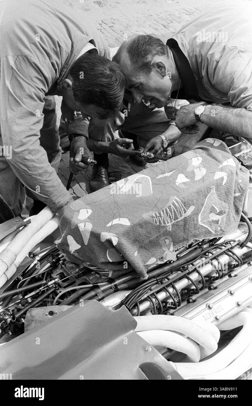 Ferrari mechanics work on a primitively concealed Ferrari V12 engine ...