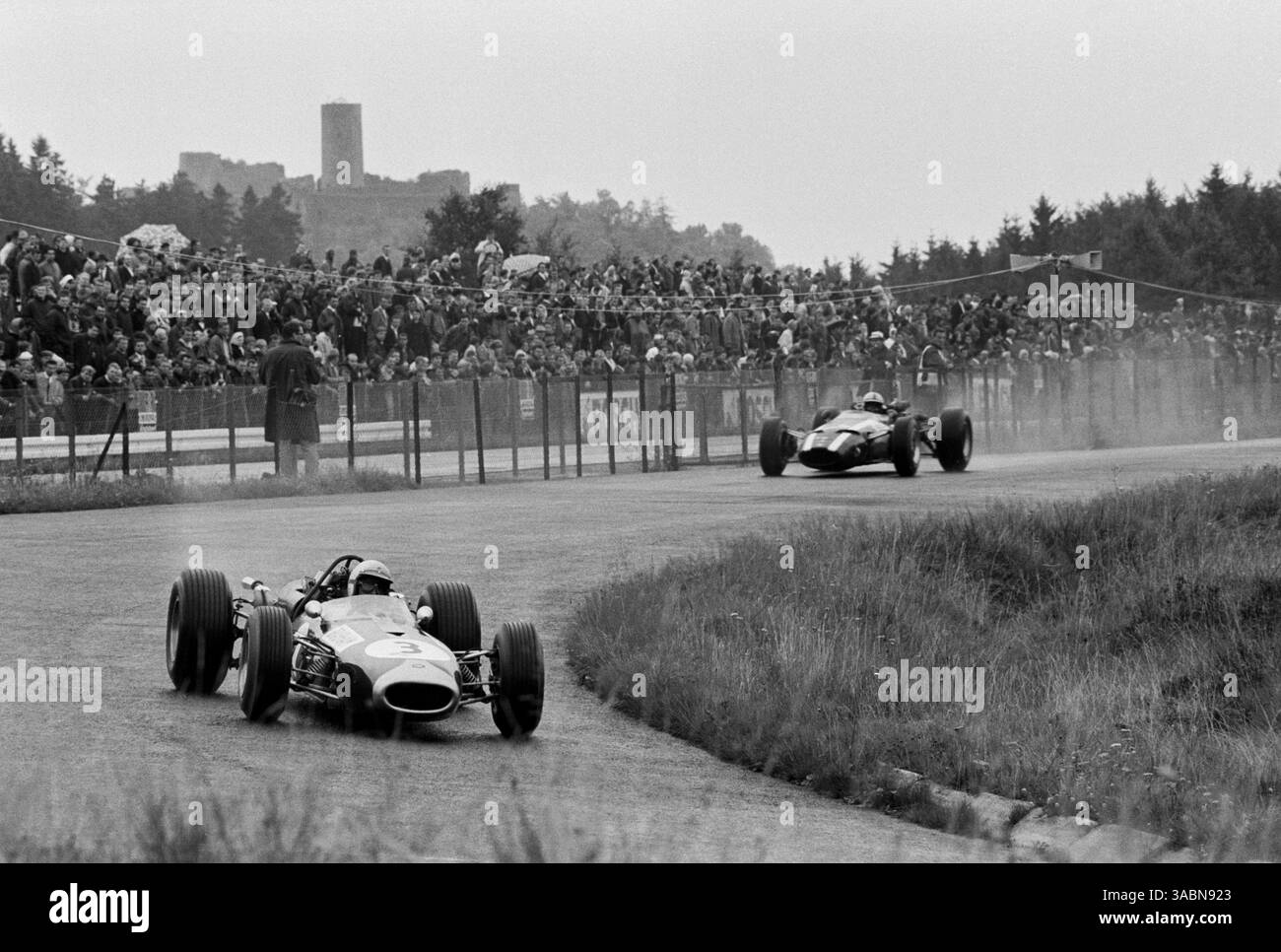 Jack Brabham (AUS) Brabham BT19 leads second placed John Surtees (GBR ...