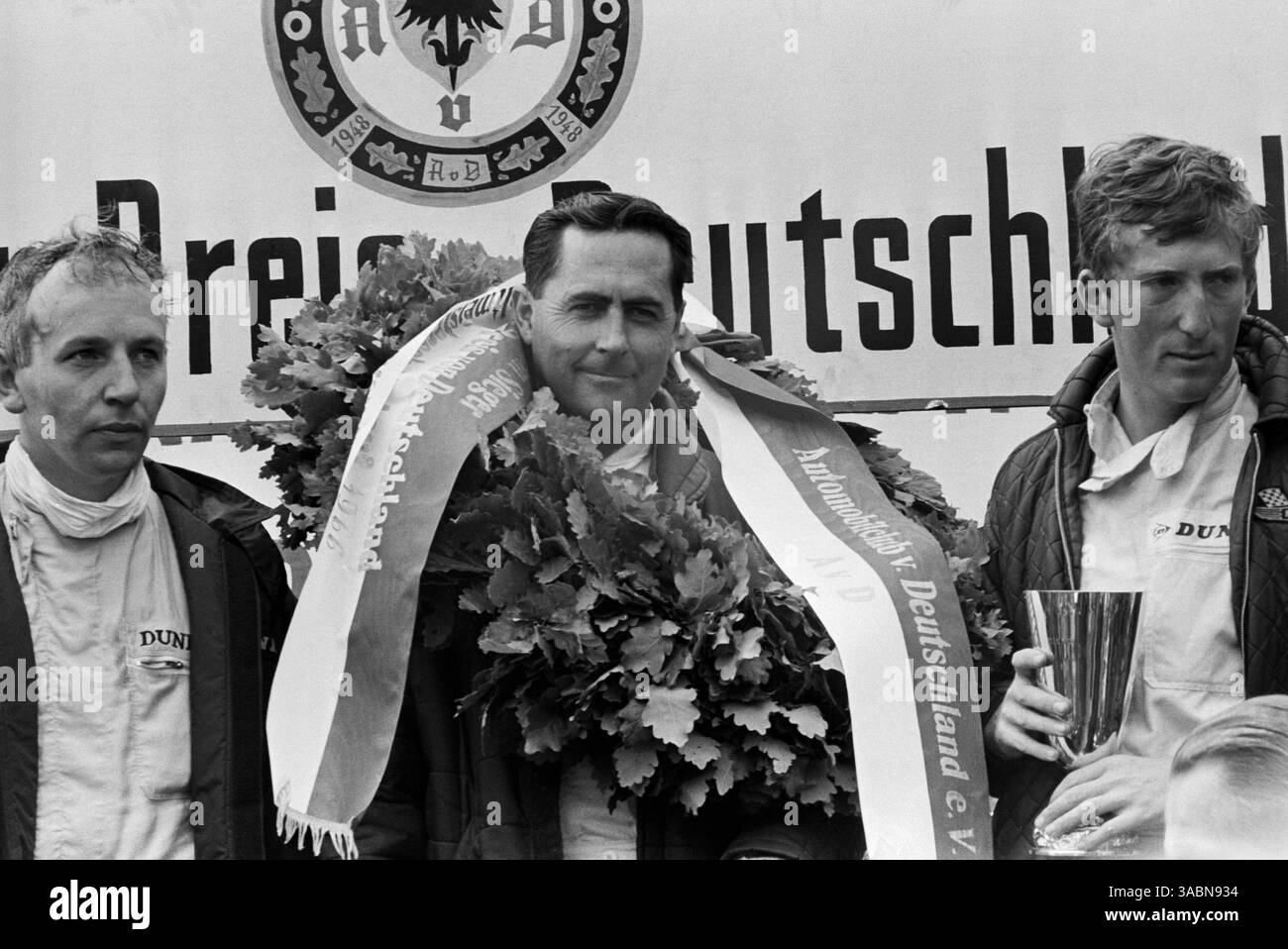 The podium (L to R): John Surtees (GBR) Cooper second; Jack Brabham ...
