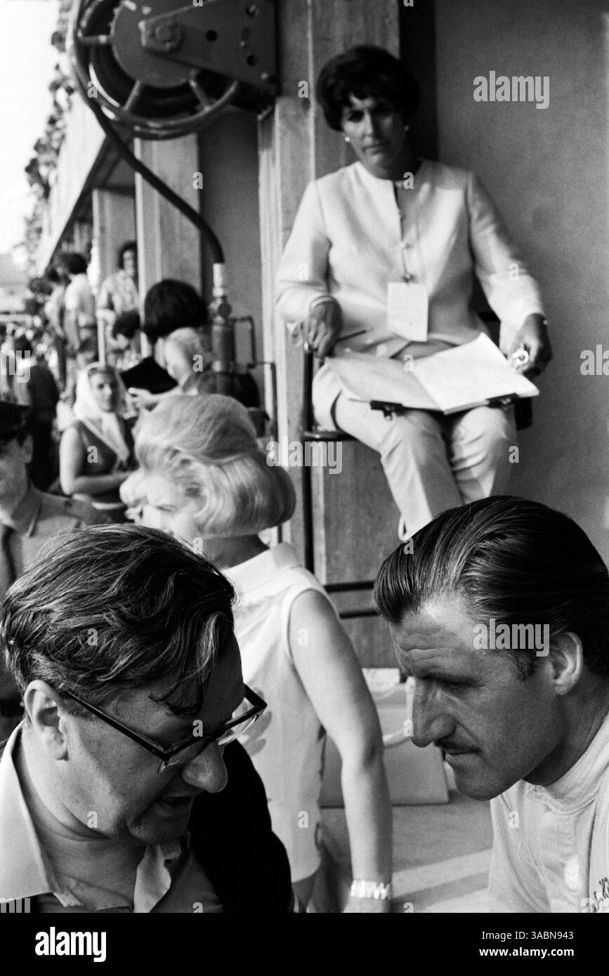 L to R): Tony Rudd (GBR) BRM Chief Designer talks with Graham Hill (GBR ...