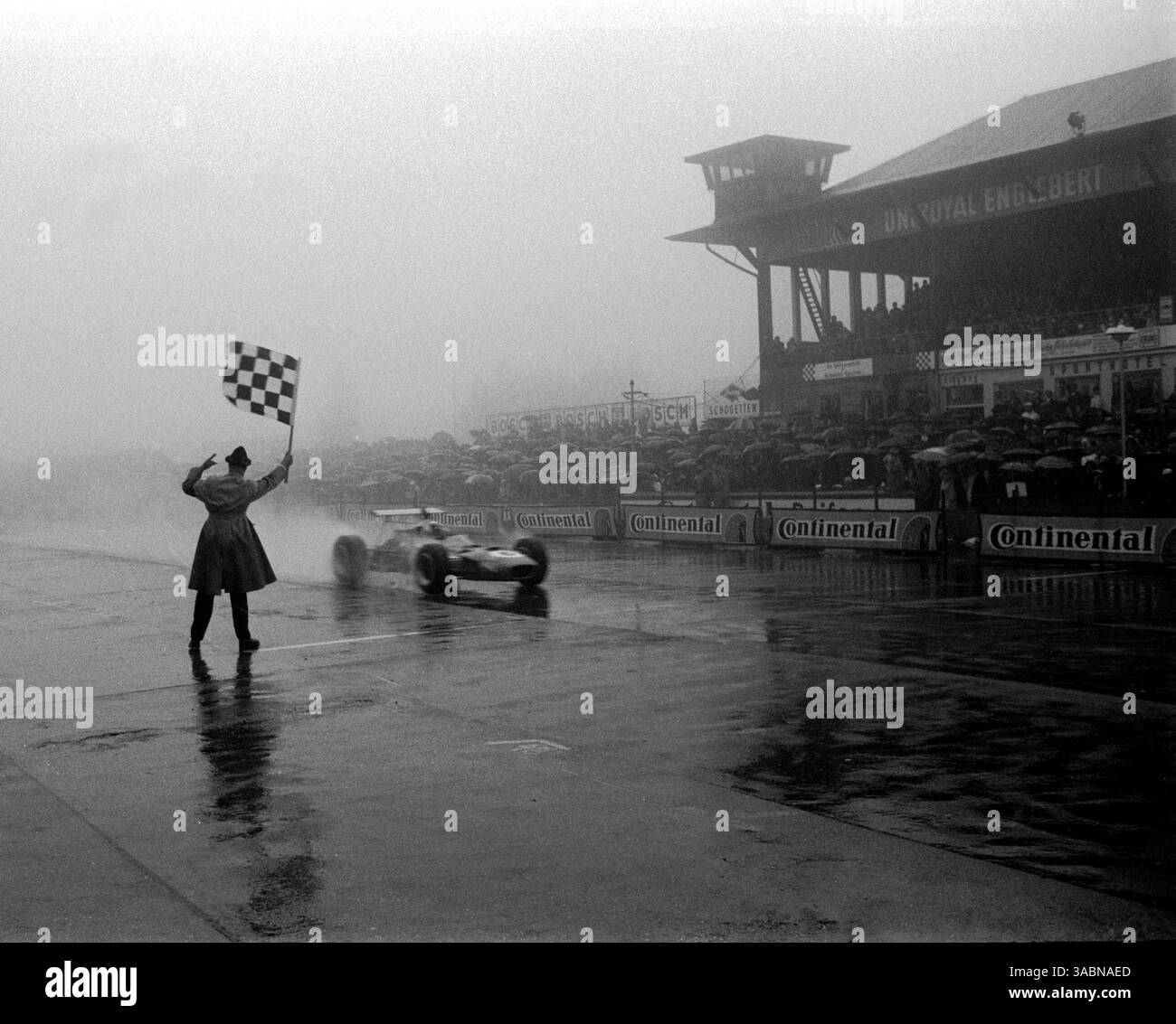 Jackie Stewart (GBR) Matra MS10 receives the chequered flag and wins ...