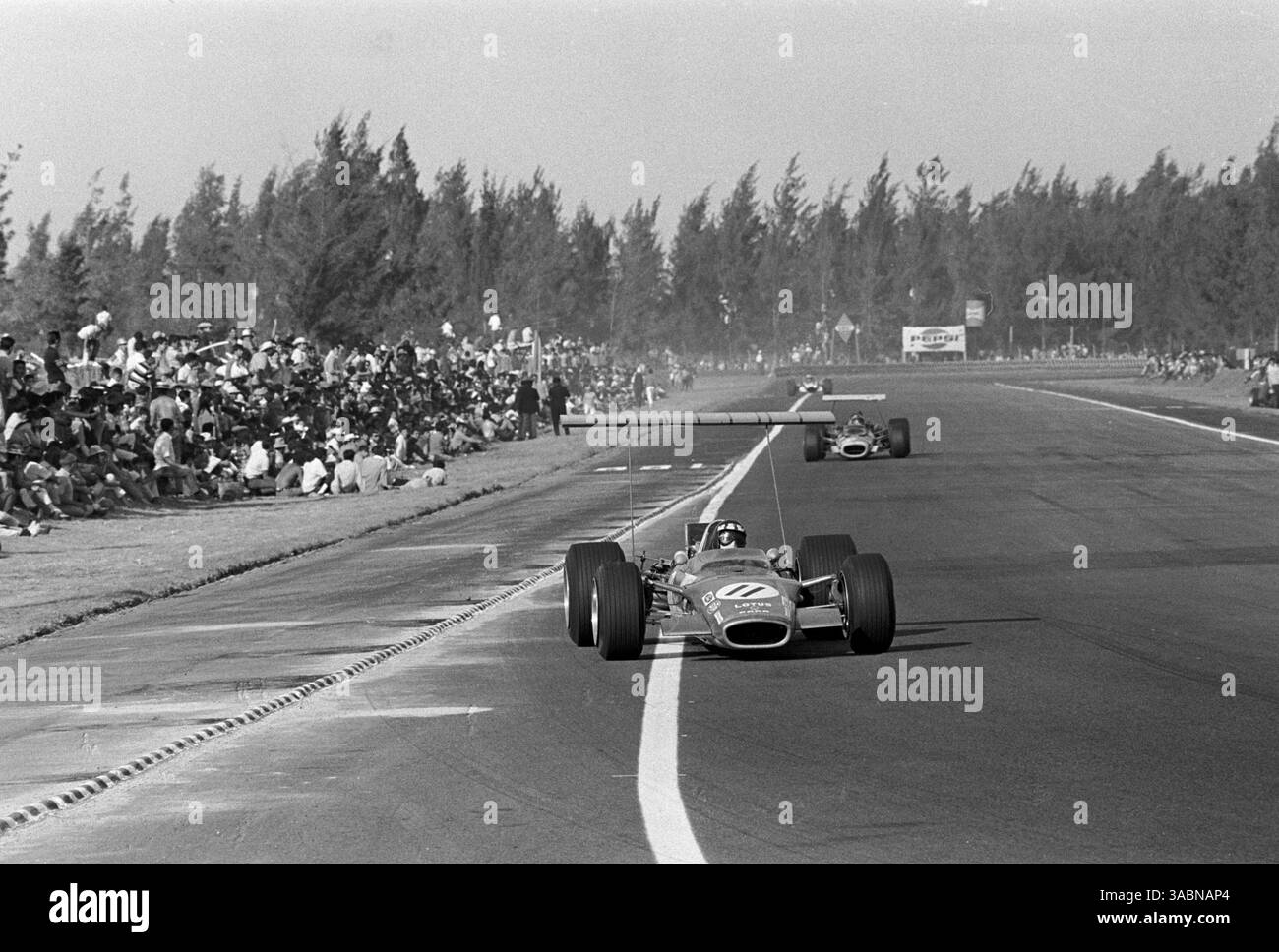 Jackie Oliver(GBR) Lotus 49B 3rd place leads Pedro Rodriguez(MEX) BRM ...