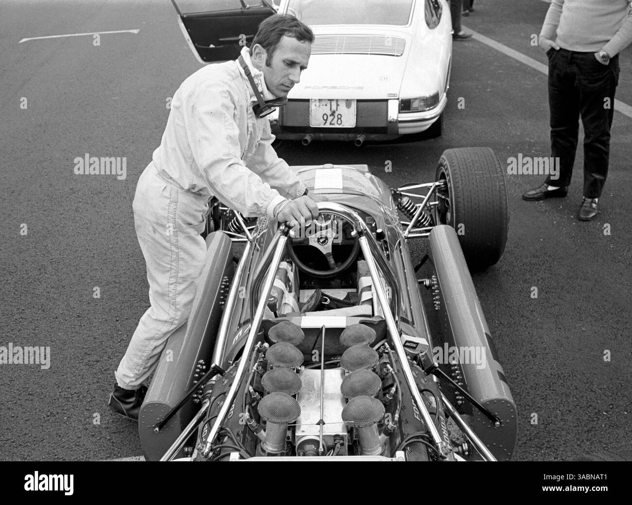 Silvio Moser(SUI) pushes his Brabham BT24 complete with pannier fule ...