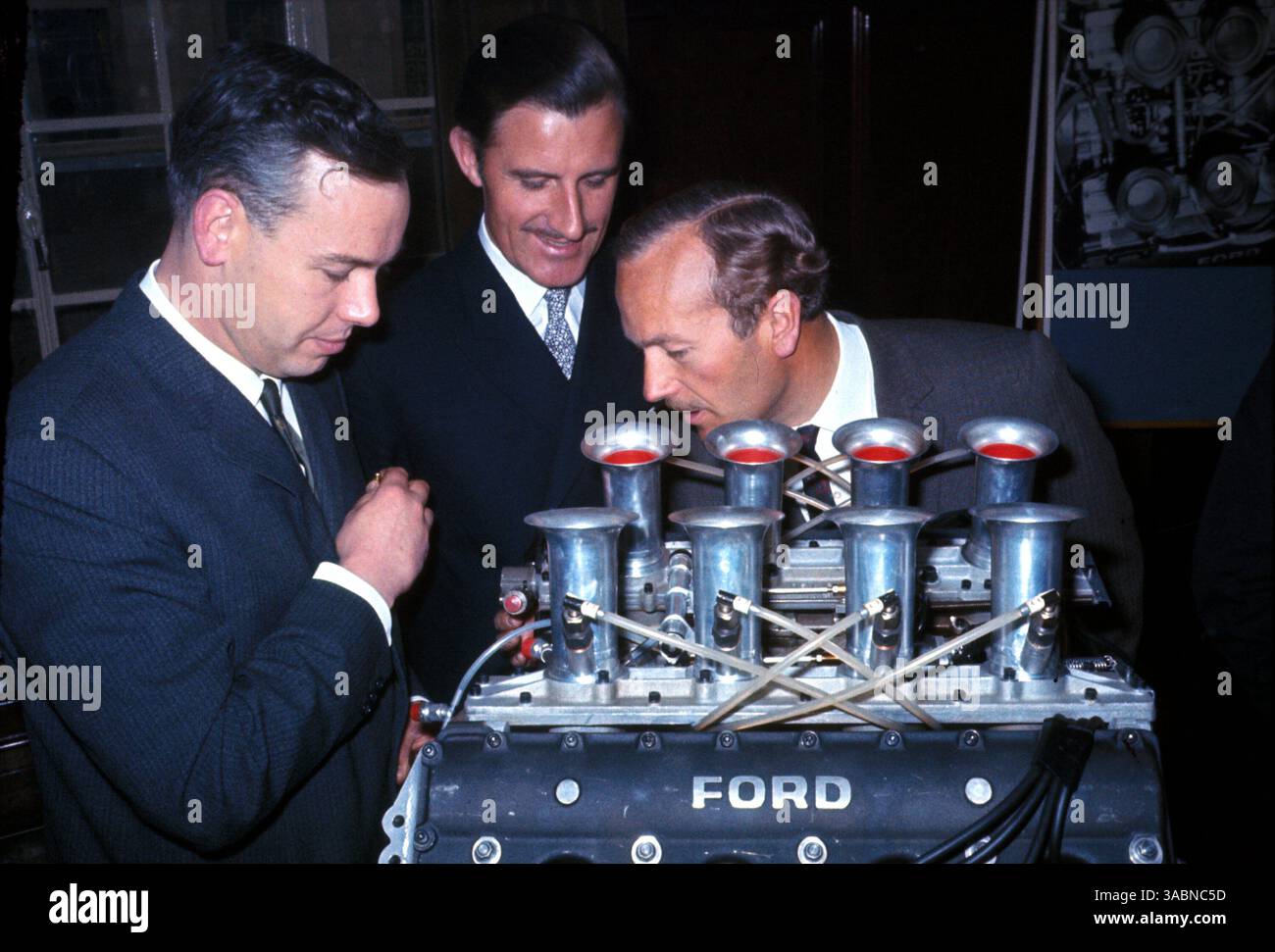 Colin Chapman(GBR) Team Lotus Boss left, with..Keith Duckworth left and ...