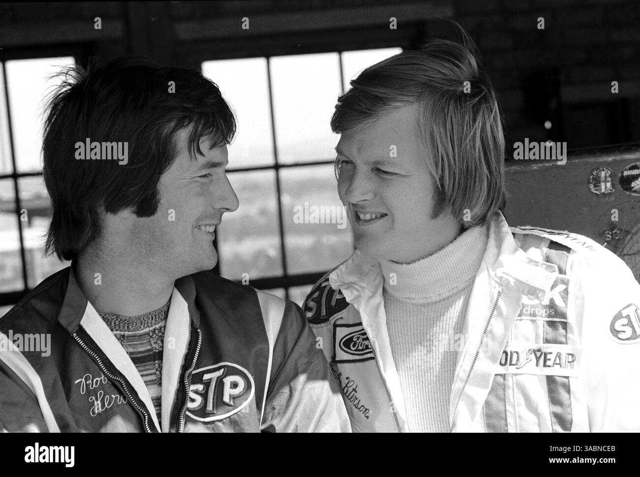 March designer Robin Herd(GBR) left, enjoys a joke with Ronnie Peterson ...