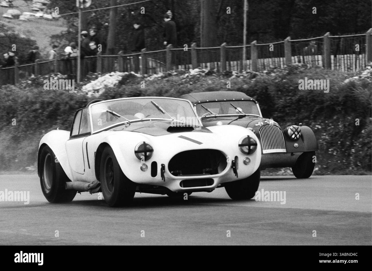 Race winners David Piper (GBR) (In car) with Bob Bondurant (USA) Shelby ...