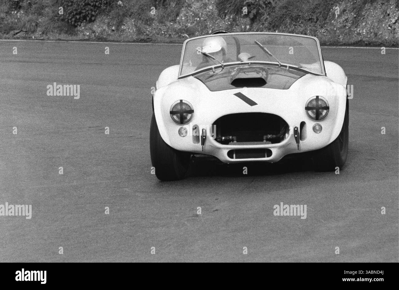 Race winners David Piper (GBR) (In car) with Bob Bondurant (USA) Shelby ...