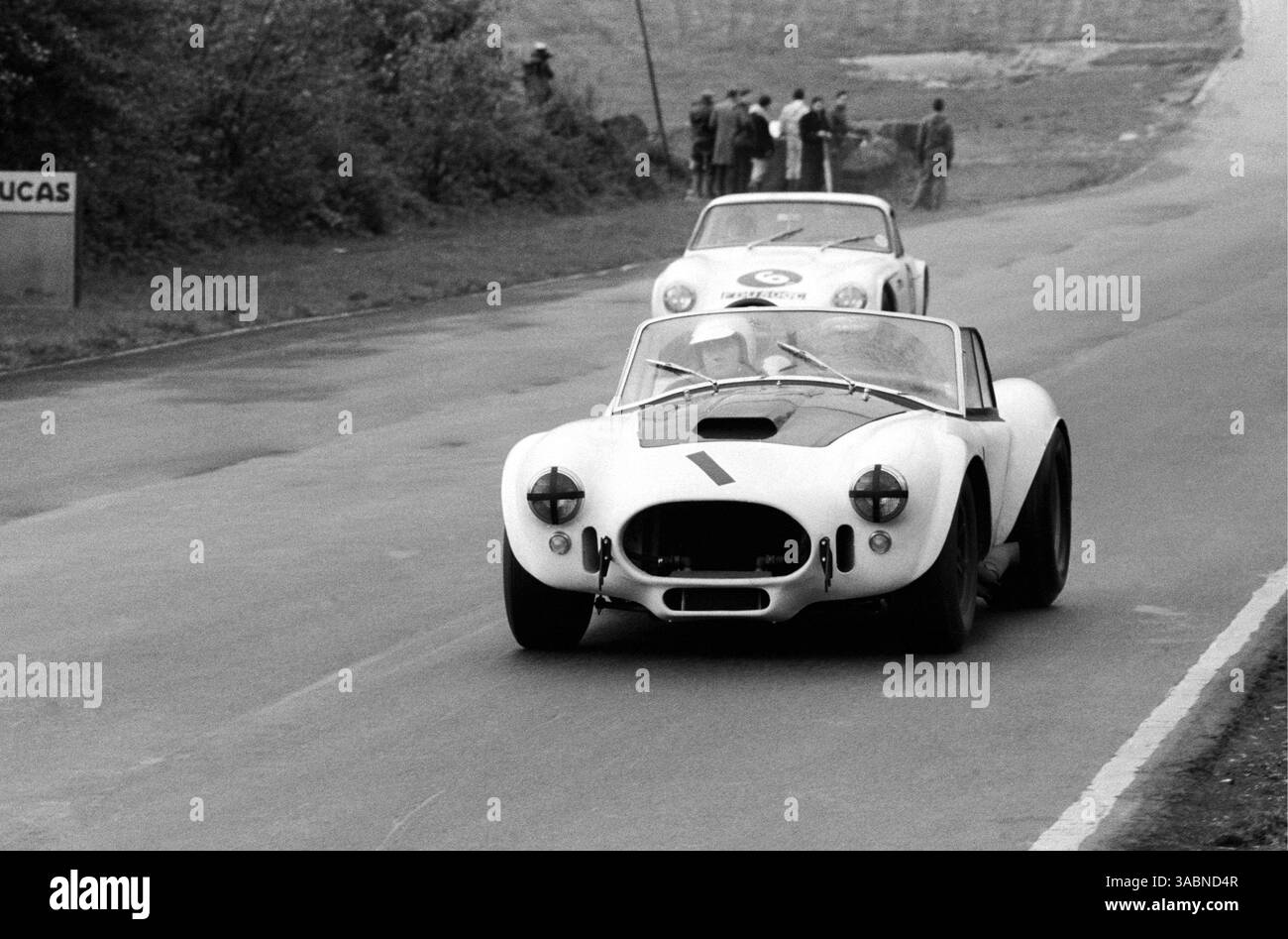 Race winners David Piper (GBR) (In car) with Bob Bondurant (USA) Shelby ...