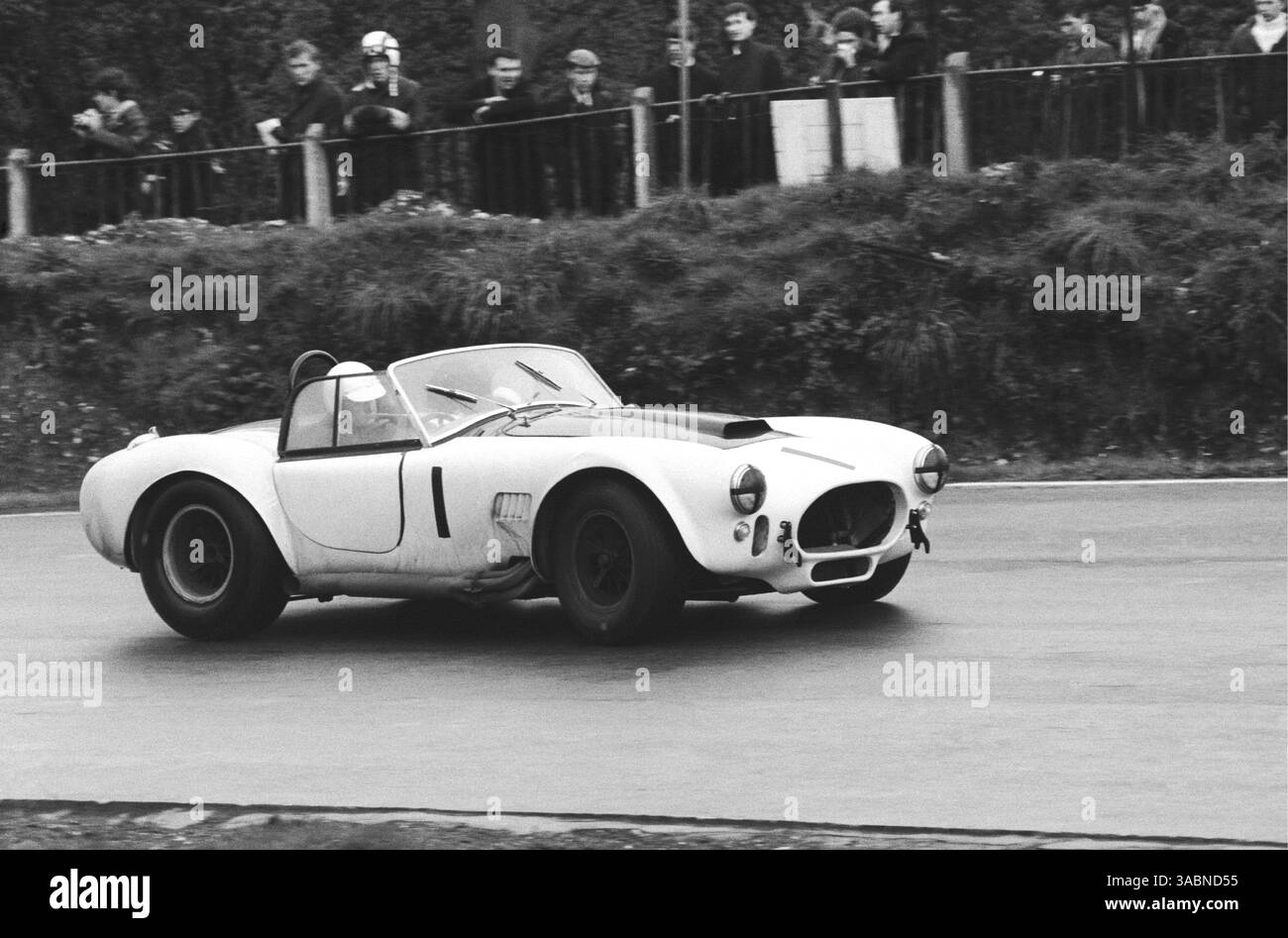 Race winners David Piper (GBR) (In car) with Bob Bondurant (USA) Shelby ...