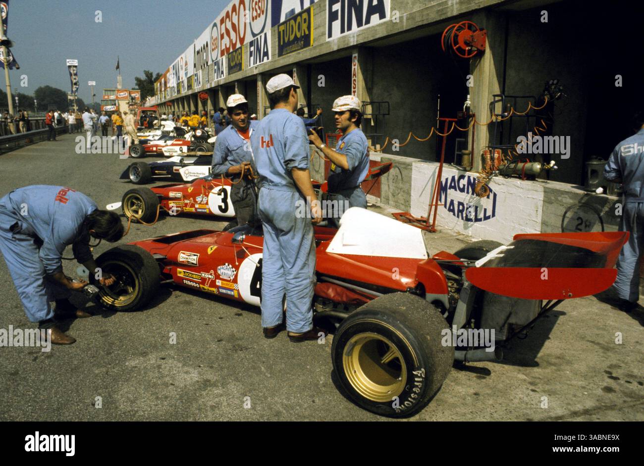 The Ferrari mechanics work on the Ferrari 312B3 of Arturio Merzario ...