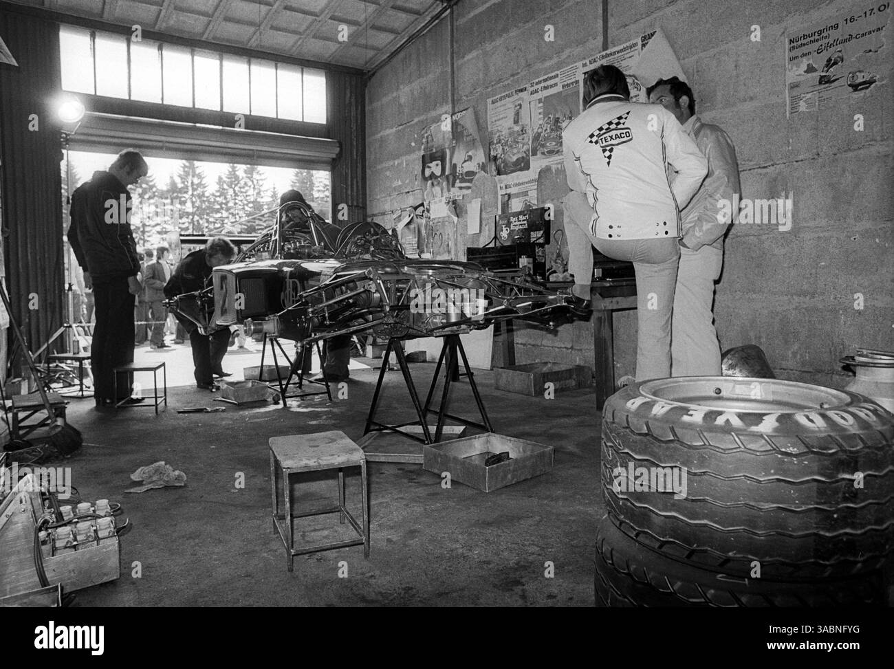 Lotus mechanics work on a Lotus 72E in the pit garage..German Grand ...