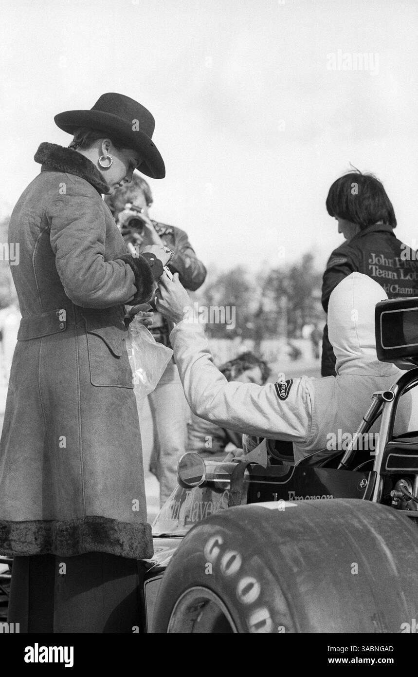 Maria Helena Fittipaldi (BRA) (Left) lends a hand to sixth placed ...