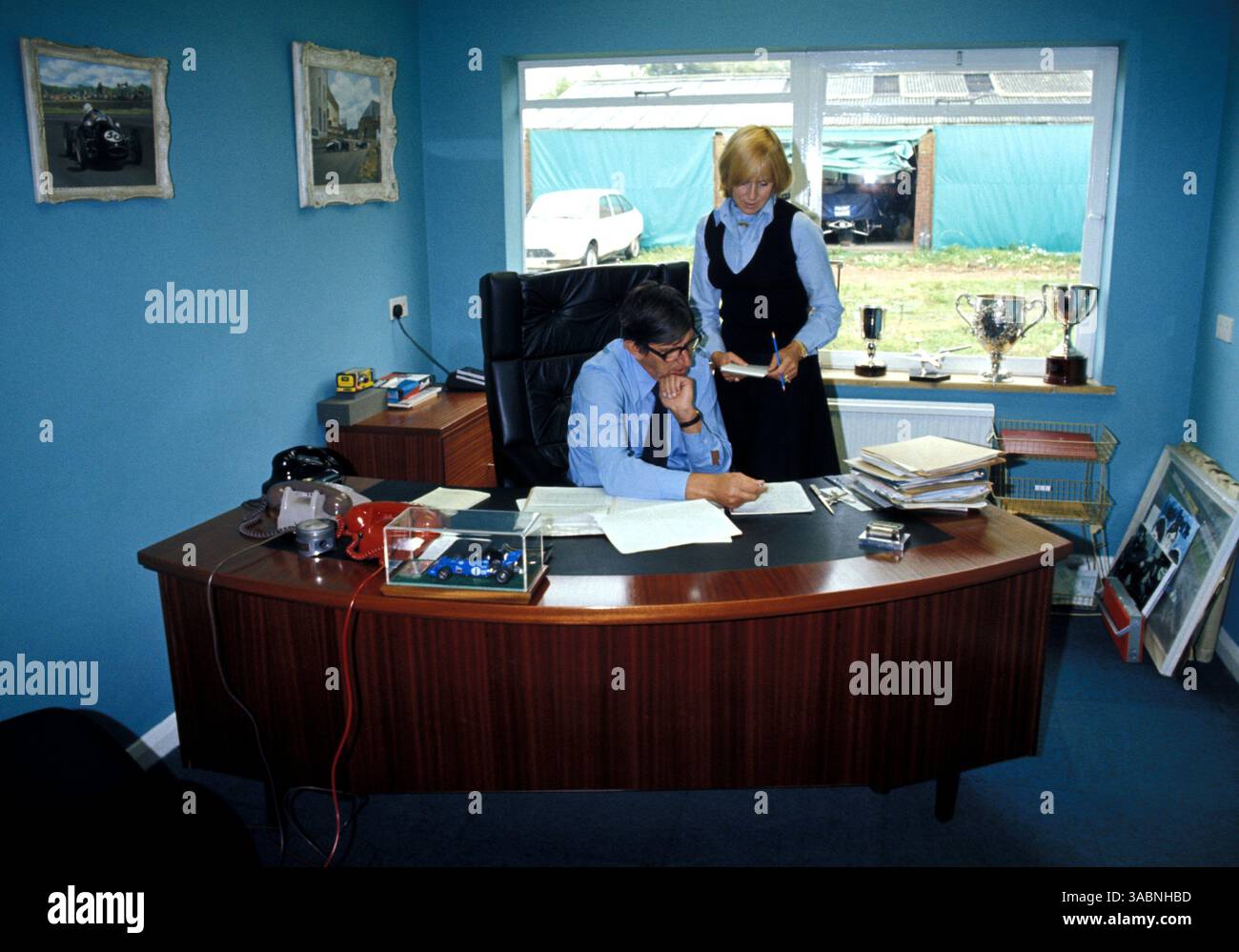 Team owner Ken Tyrrell (GBR) and wife Norah in his office at the ...