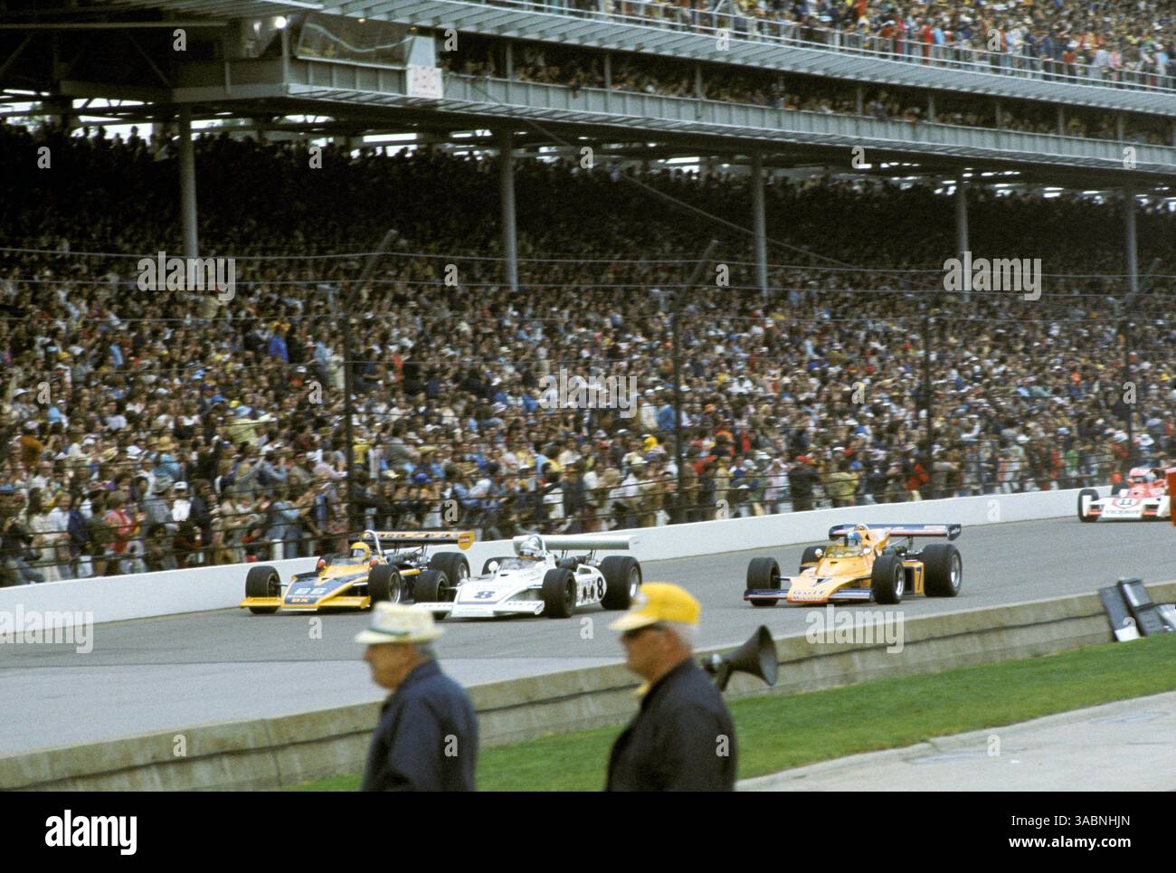 L-R) Mark Donohue (USA) Eagle Offenhauser battles with Bobby Unser (USA ...