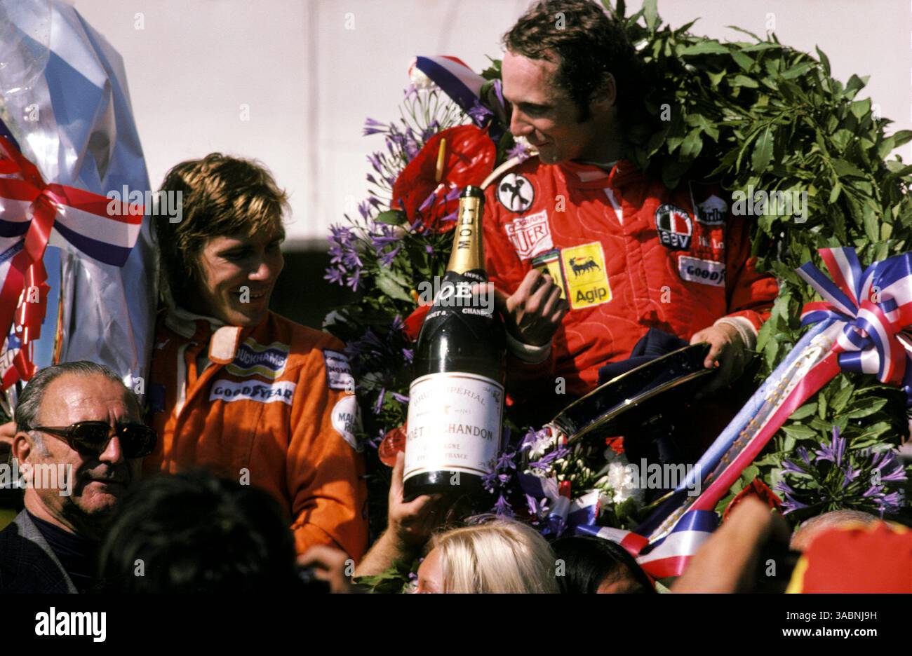 The podium (L to R): James Hunt (GBR) McLaren, second; Niki Lauda (AUT ...