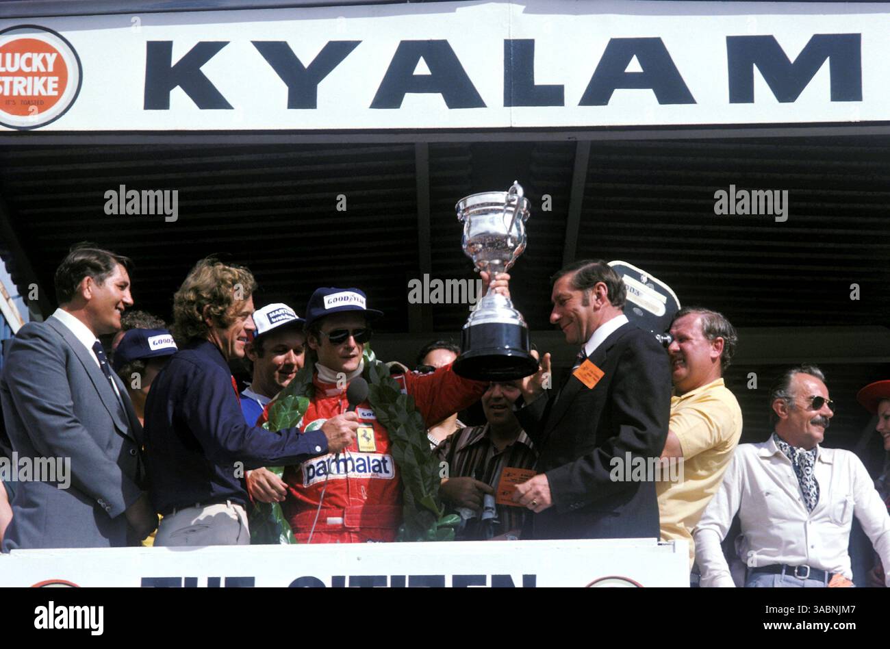 Niki Lauda (AUT) Ferrari celebrates his victory on the podium..South ...