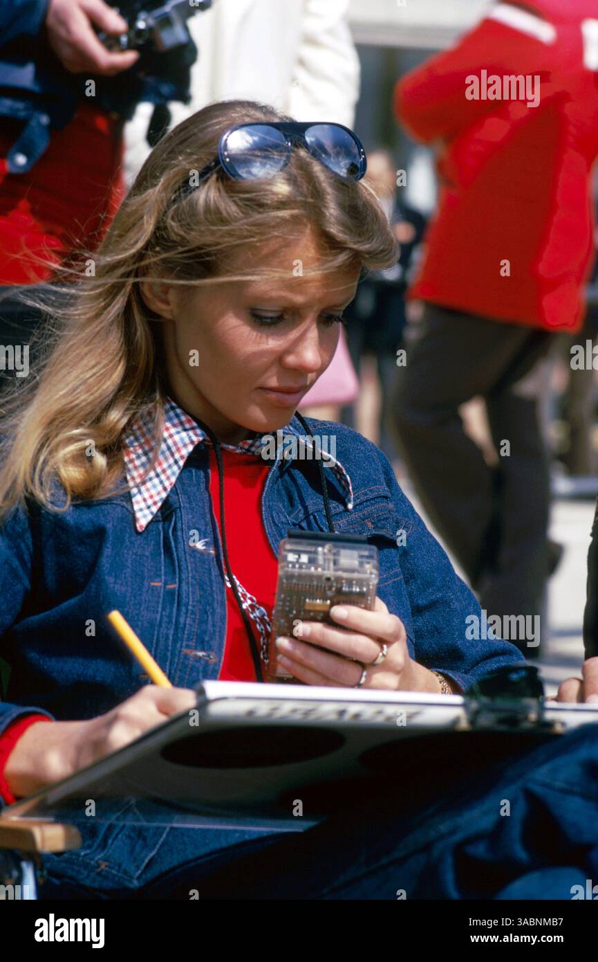 Barbro Peterson (SWE) keeps a timing chart for her husband Ronnie ...