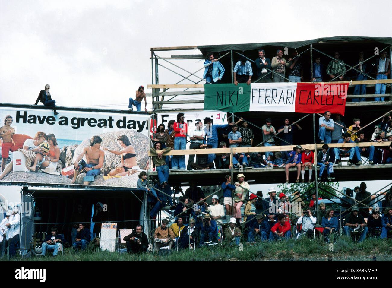 South African race fans support Ferrari drivers Niki Lauda (AUT) and ...
