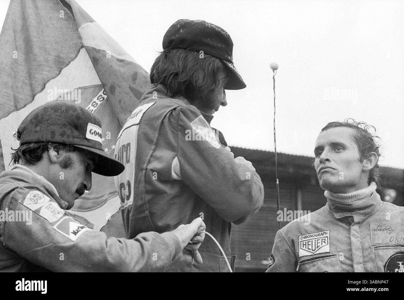 The podium (L to R): Clay Regazzoni (SUI) Ferrari, second; Emerson ...