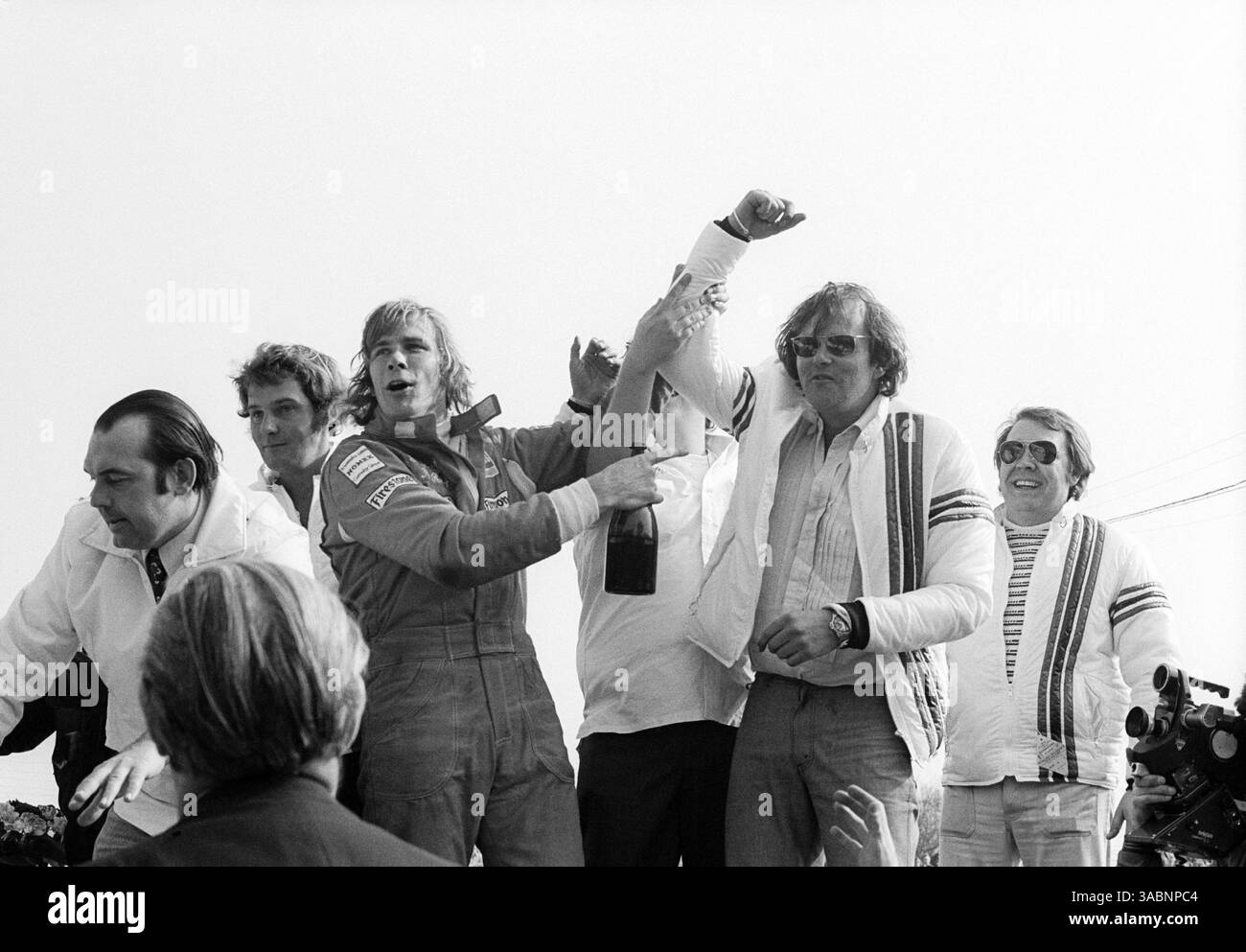 Race winner James Hunt (GBR) (Left) celebrates his and Hesketh's first ...