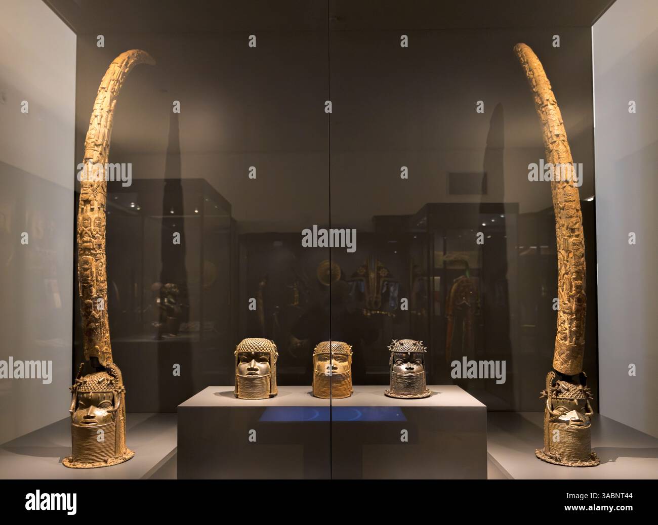 ivory tusks with relief carving and brass heads, Benin Kingdom ...