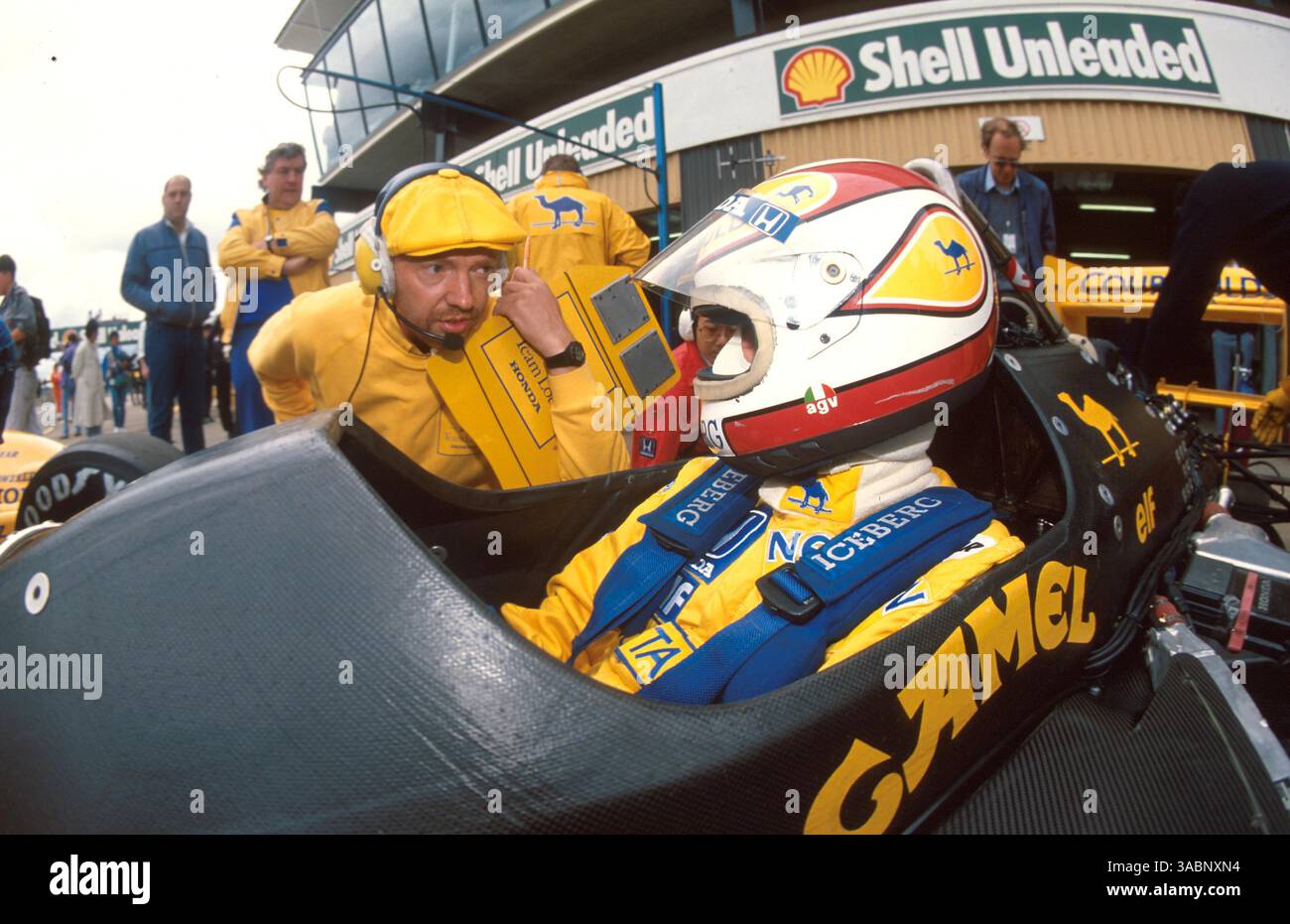 Nelson Piquet (BRA) Lotus 100T talks with his race engineer...British ...