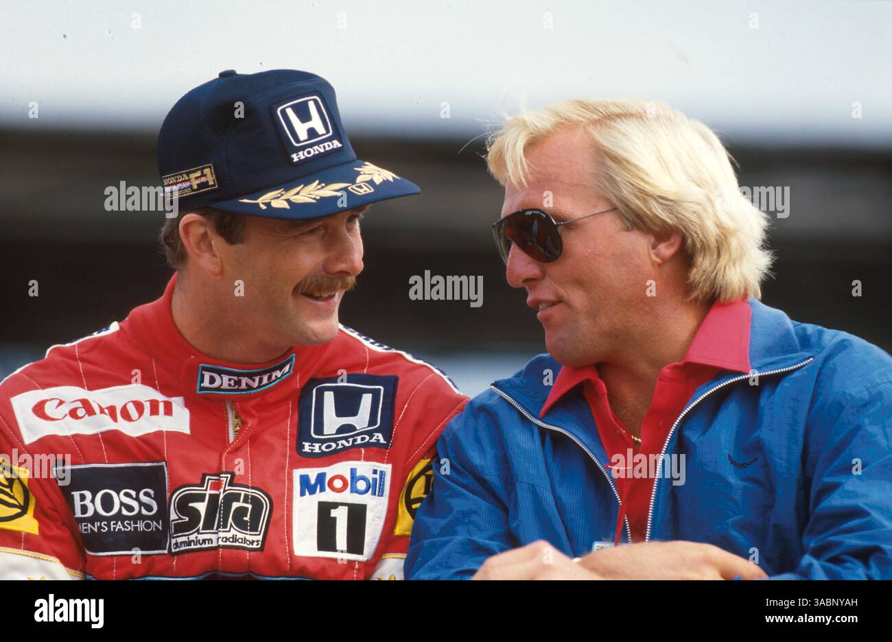 Nigel Mansell, left, with Pro Golfer Greg Norman...Australian Grand ...