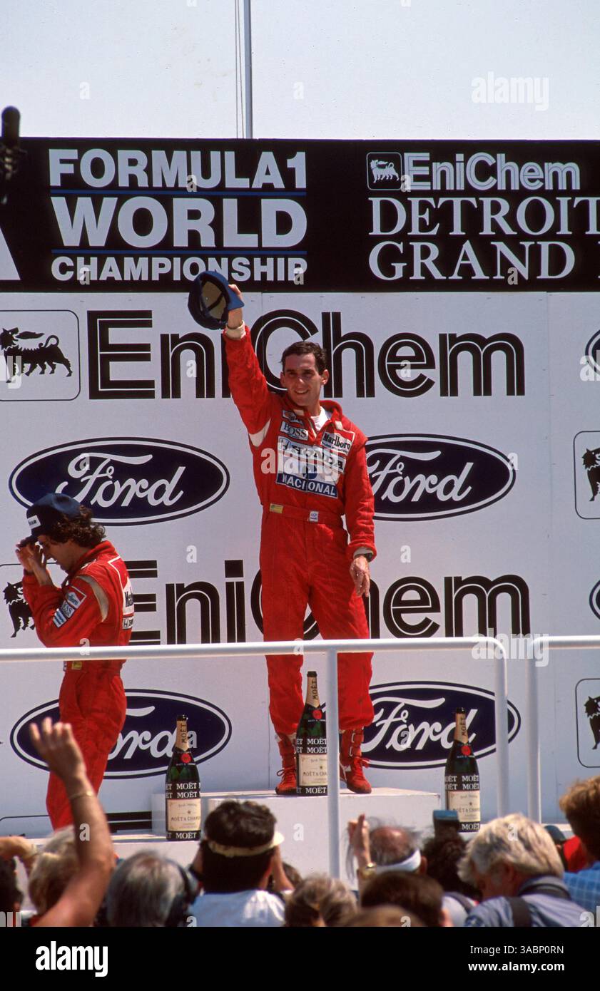 Race winner Ayrton Senna celebrates on the podium...USA Grand Prix ...
