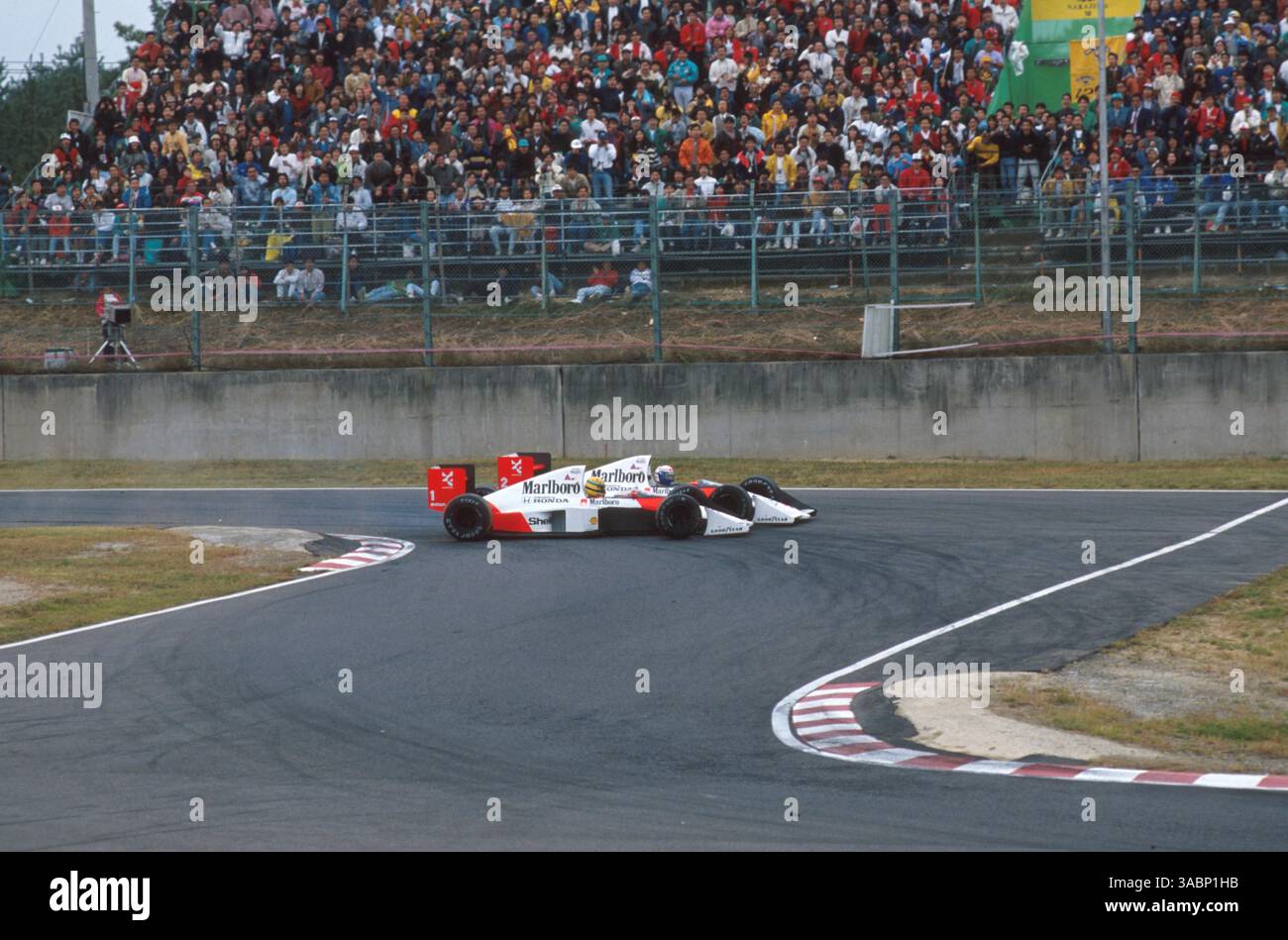 Ayrton Senna (BRA) McLaren MP4/5 and Alain Prost (FRA) in the collision ...