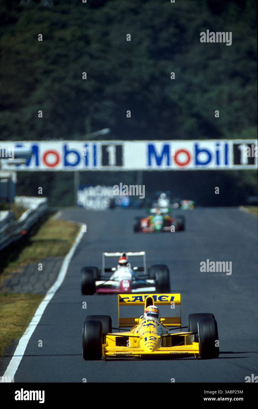 On his home circuit, Satoru Nakajima (JPN) Lotus 101 leads Eddie ...