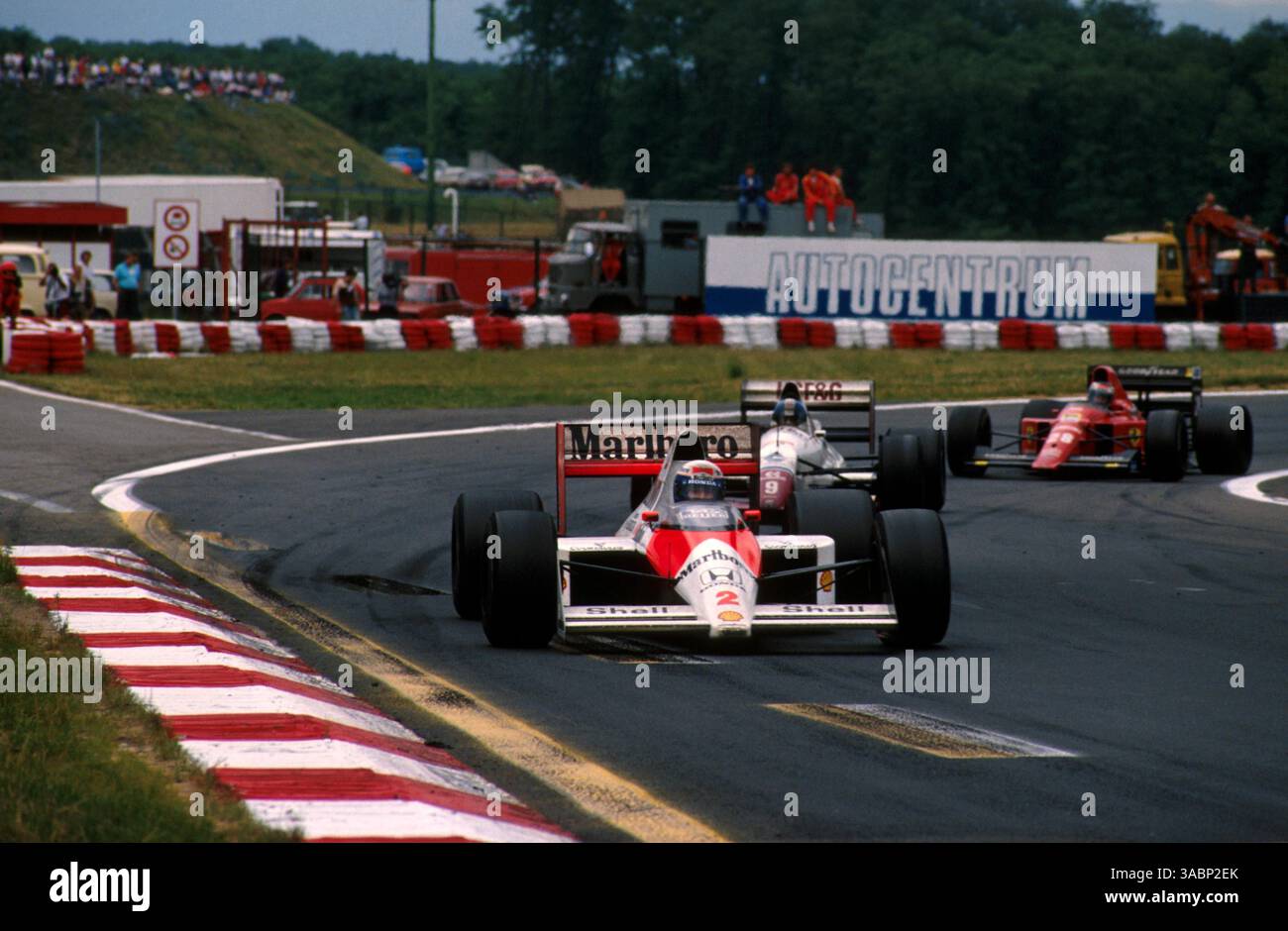 Alain Prost (FRA) McLaren MP4/5 finished fourth. He leads Derek Warwick ...