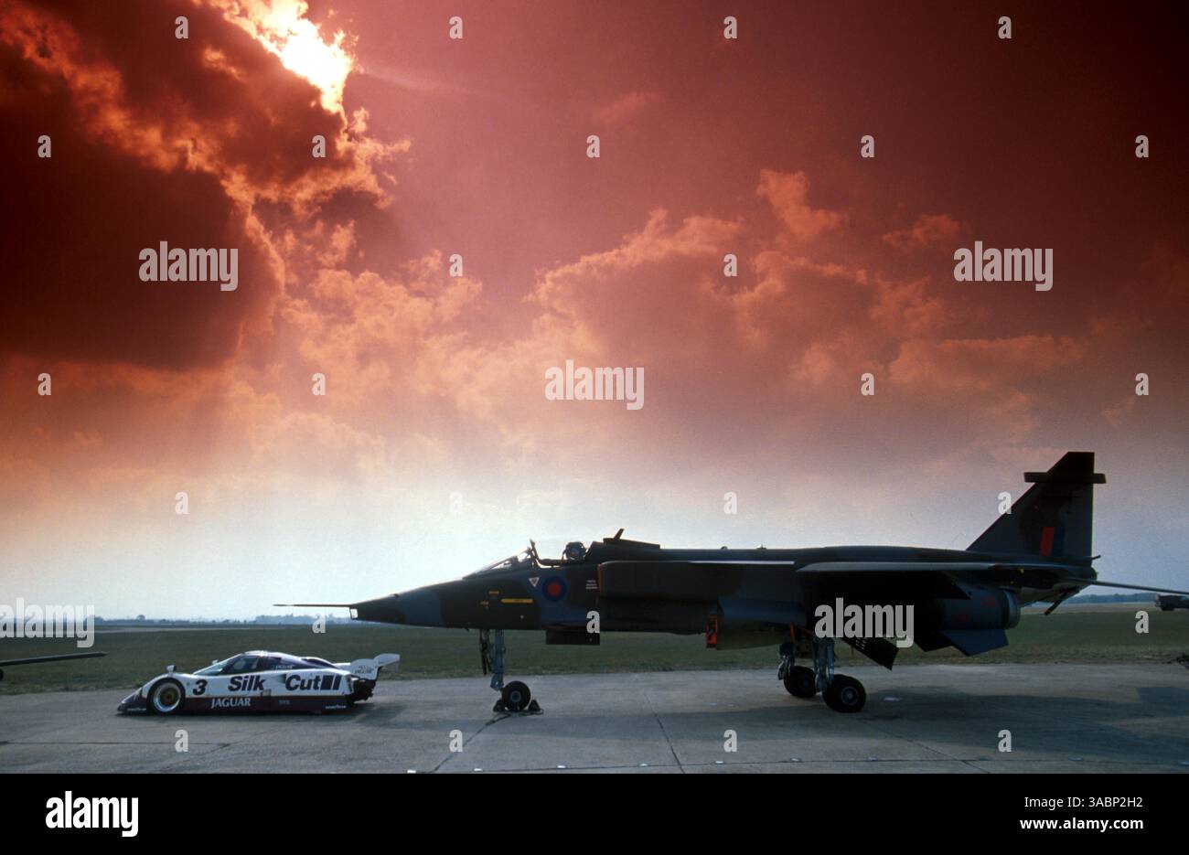 A Jaguar XJR-9 and a Royal Air Force SEPECAT Jaguar aircraft. This shot ...