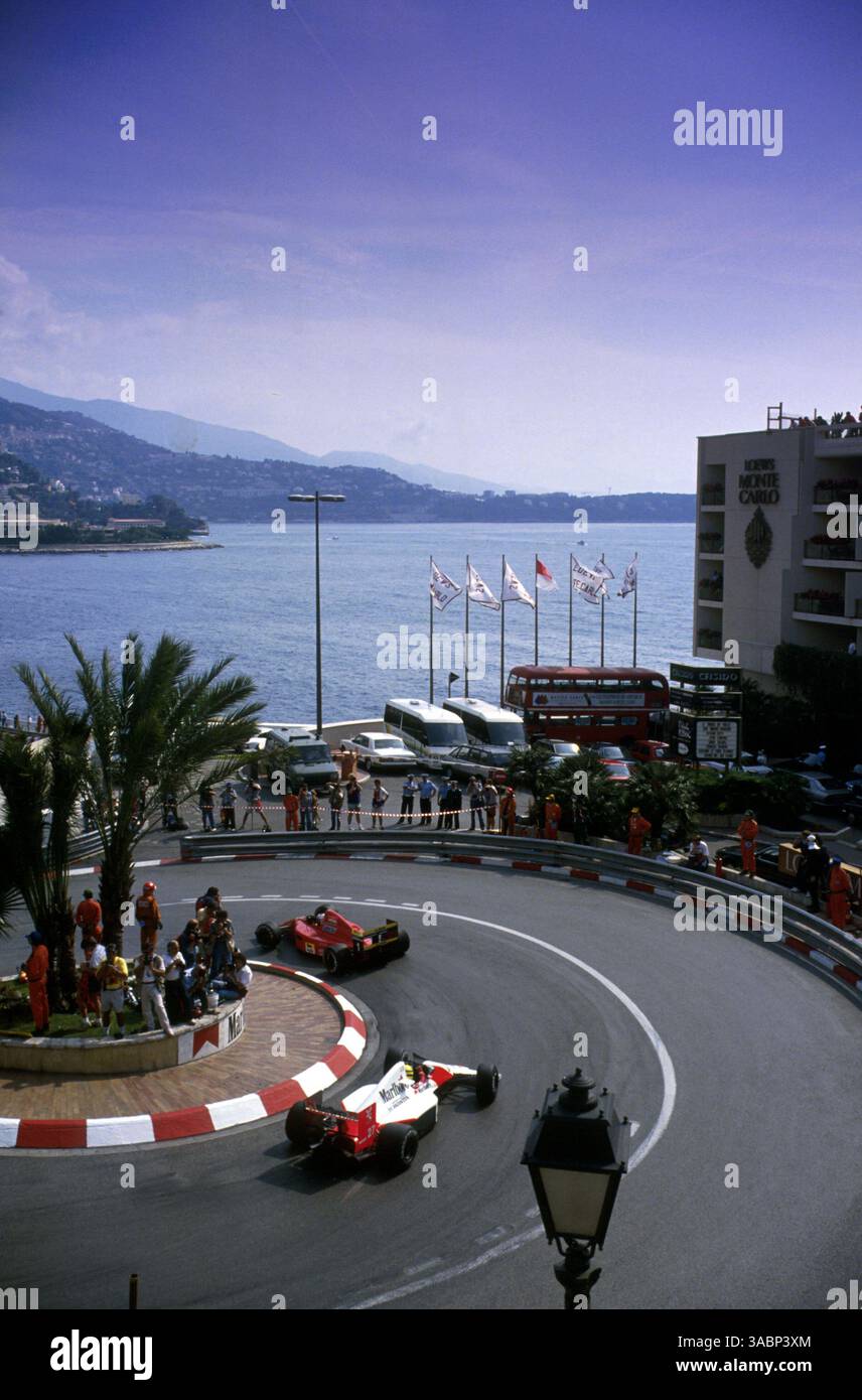Alain Prost (FRA) Ferrari 641 leads Winner Ayrton Senna (BRA) McLaren ...