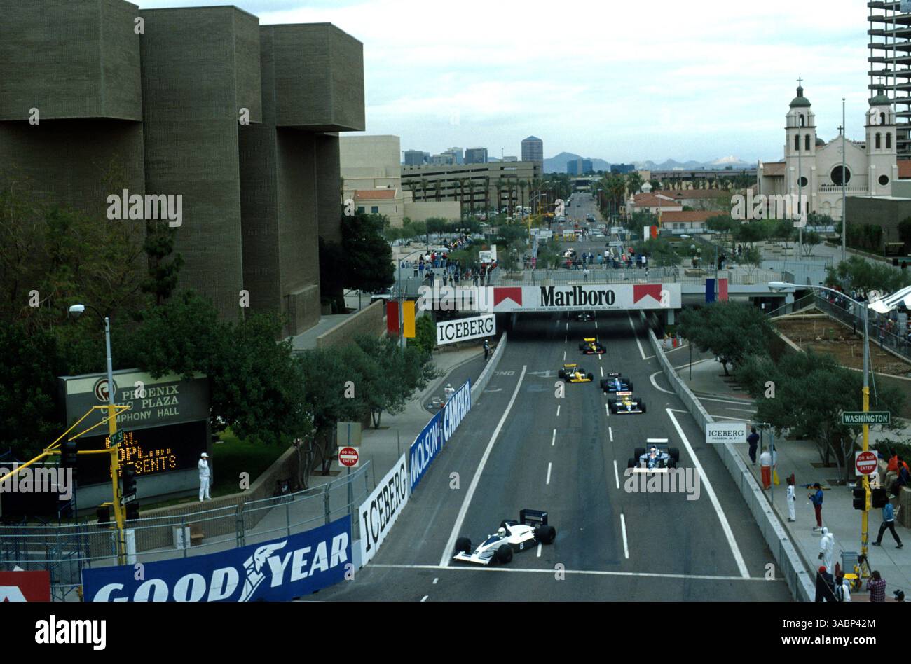 Stefano Modena (ITA) Brabham Judd BT58 leads Satoru Nakajima (JPN) Tyrrell Cosworth 018 and ...