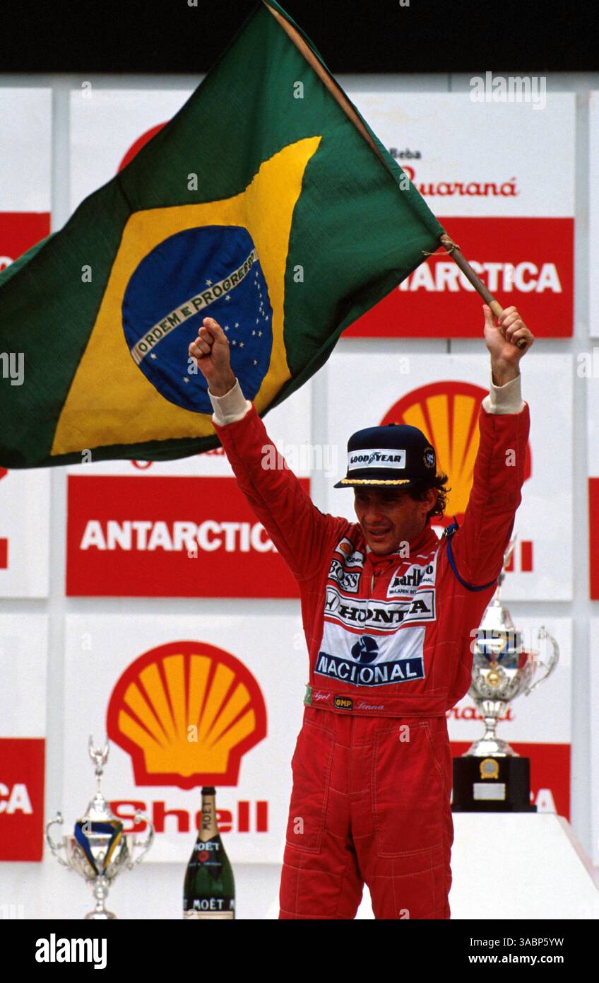 Race winner Ayrton Senna celebrates on the podium...Brazilian Grand ...