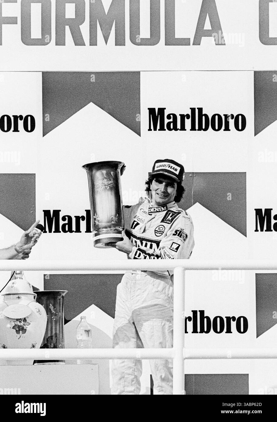 Race winner Nelson Piquet (BRA) Williams celebrates on the podium ...