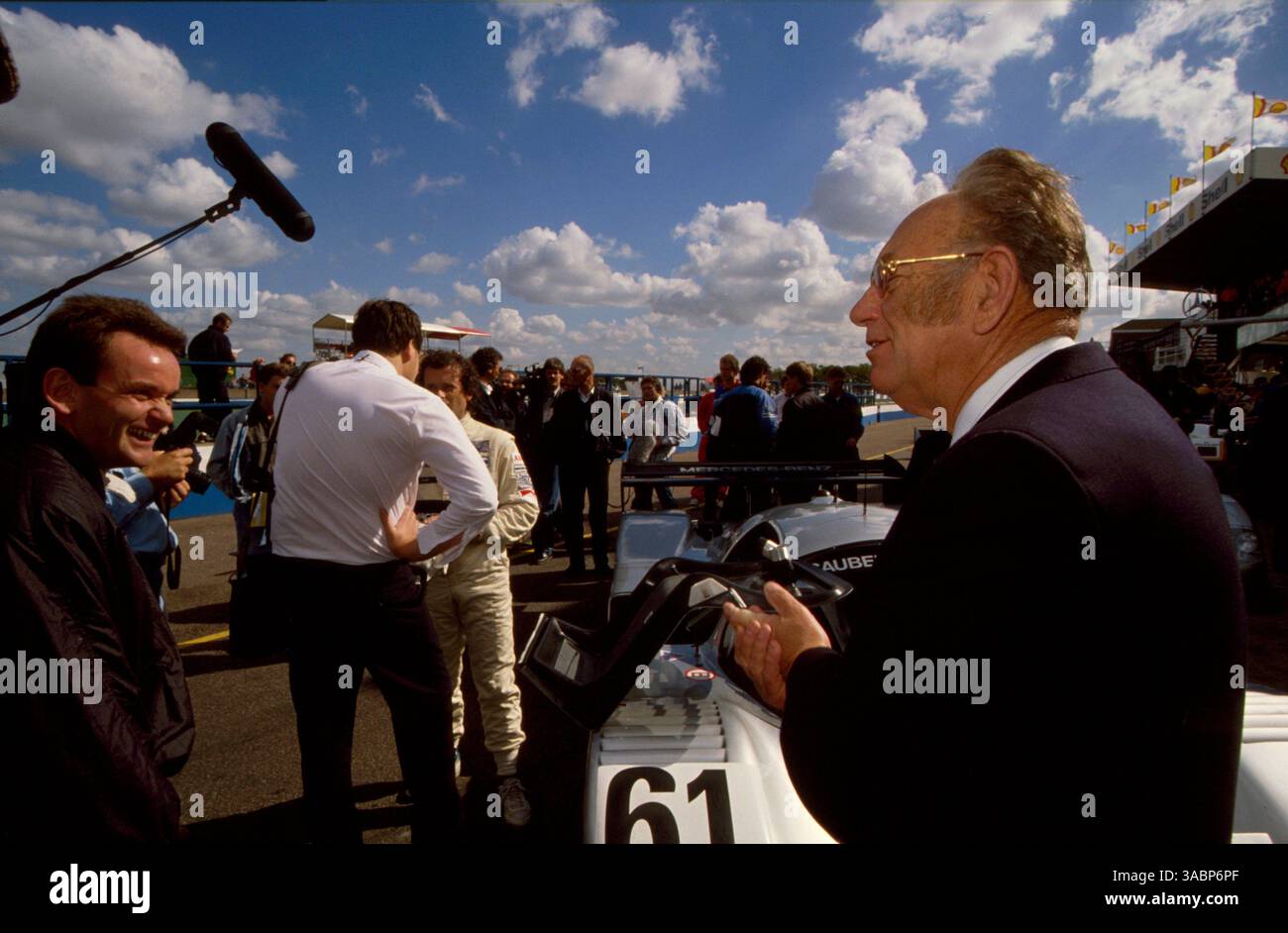 Kenny Acheson (GBR) Sauber Mercedes shares a joke with Donington Park ...
