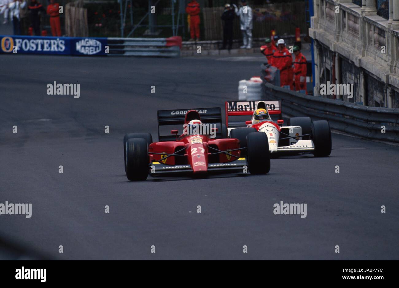 Alain Prost (FRA) Ferrari 642 leads Ayrton Senna (BRA) McLaren MP4/6 ...