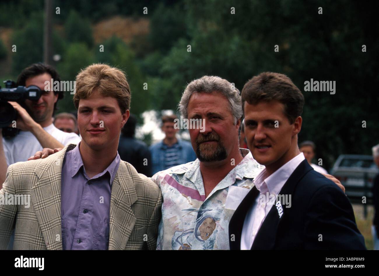 Ralf Schumacher (GER) left, and Michael Schumacher (GER) right with ...