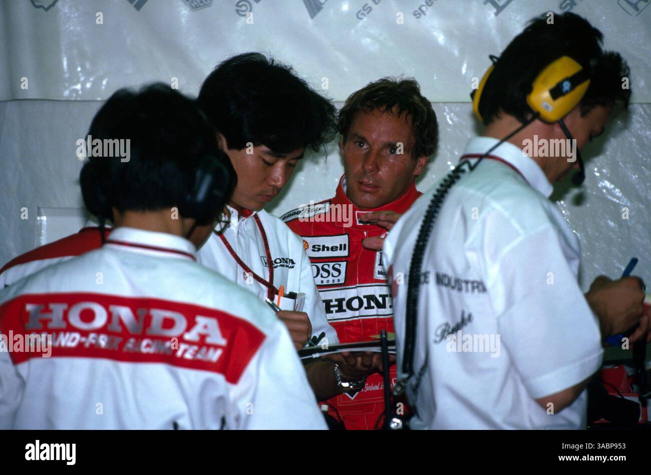 Gerhard Berger (AUT) McLaren confers with the Honda engineers in the ...