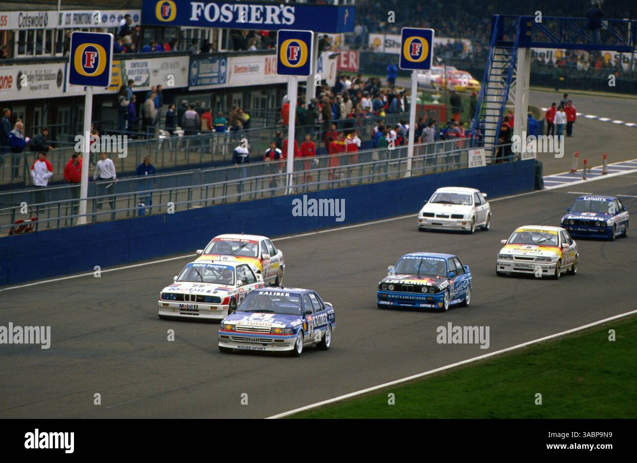 Andy Rouse (GBR) Kaliber Toyota Carina heads the field into Copse ...