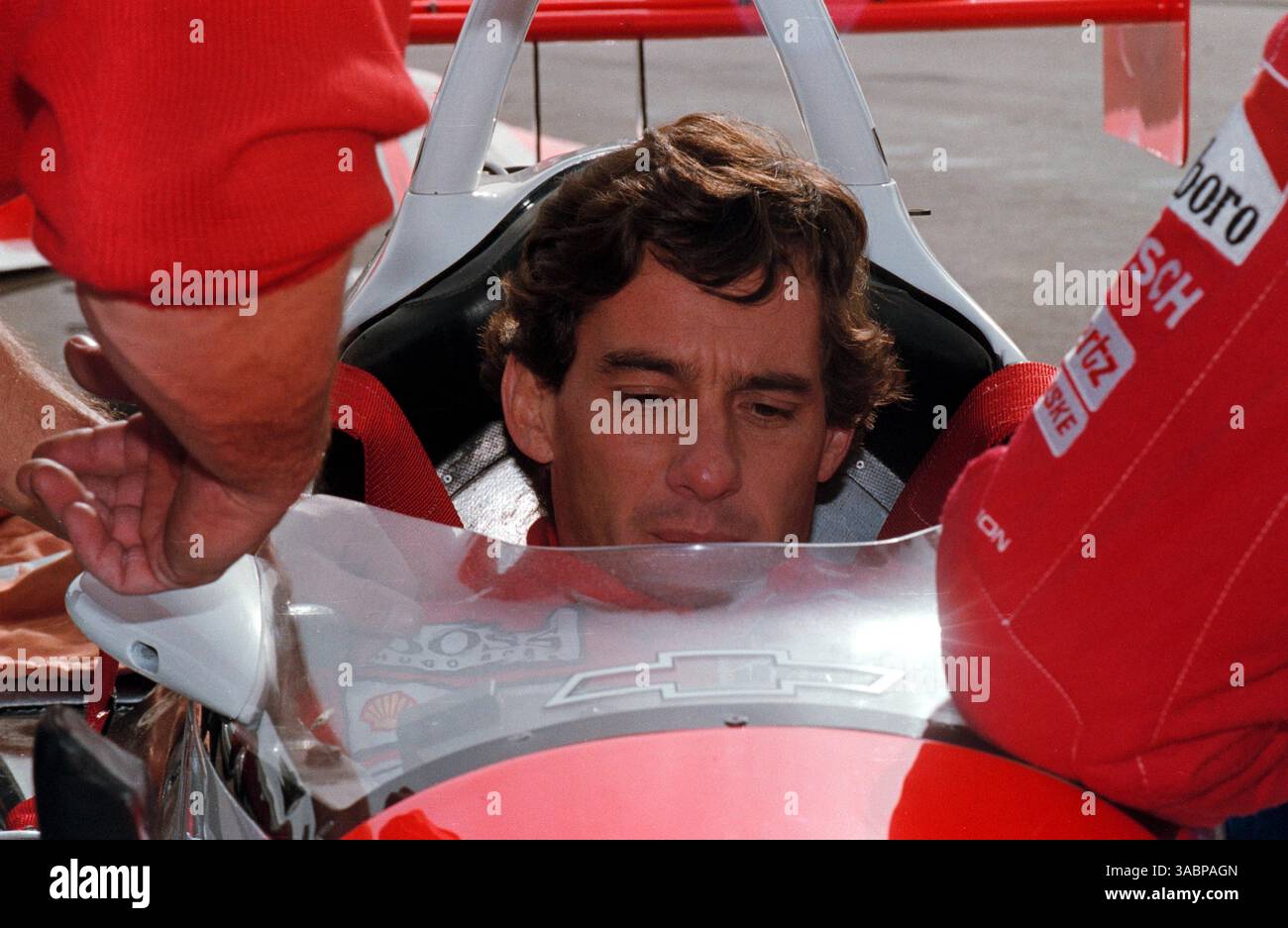 Final preparations are made before Ayrton Senna (BRA) tests the Penske ...