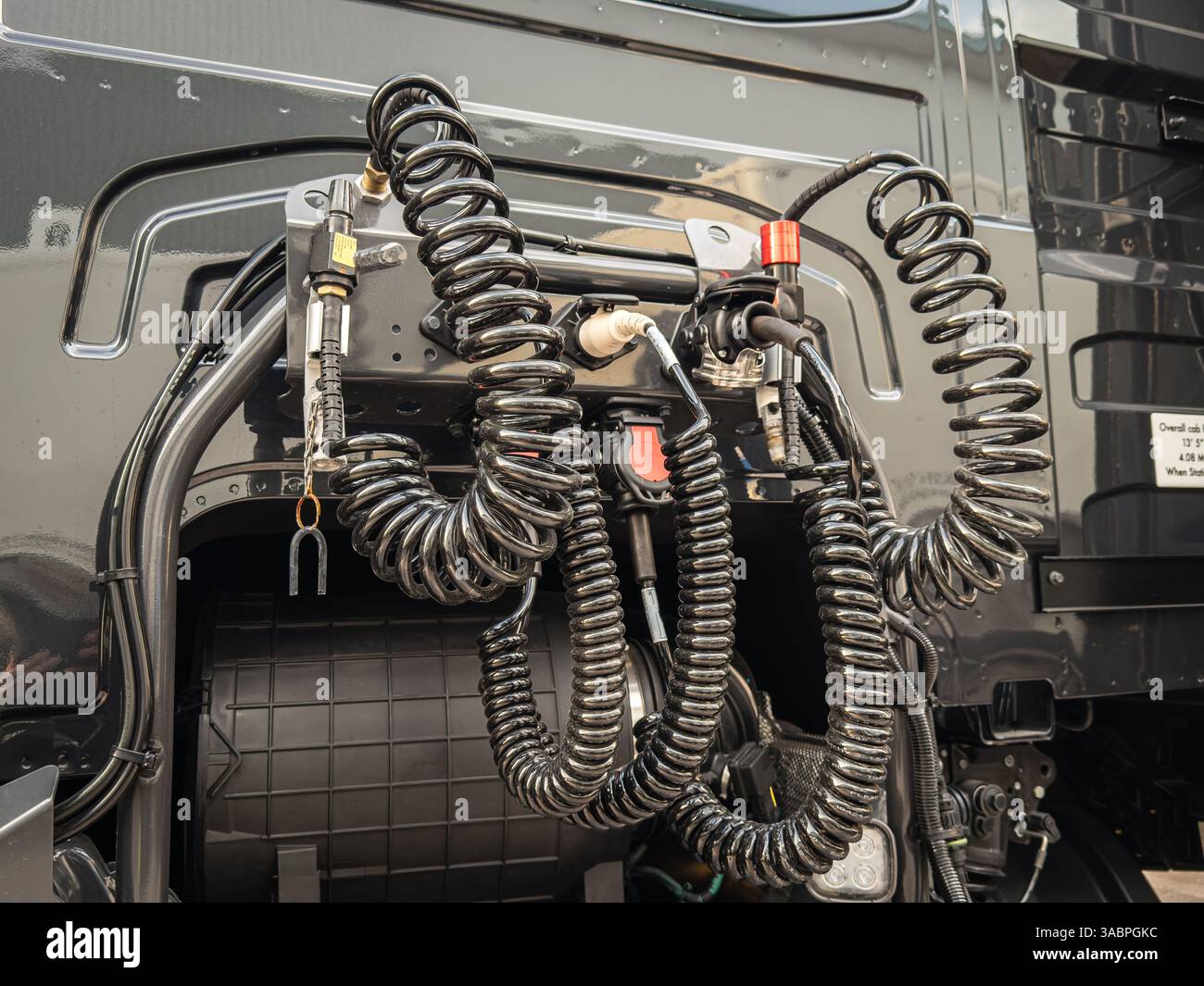 Close-up view of a fifth wheel coupling system and electric cables on a ...