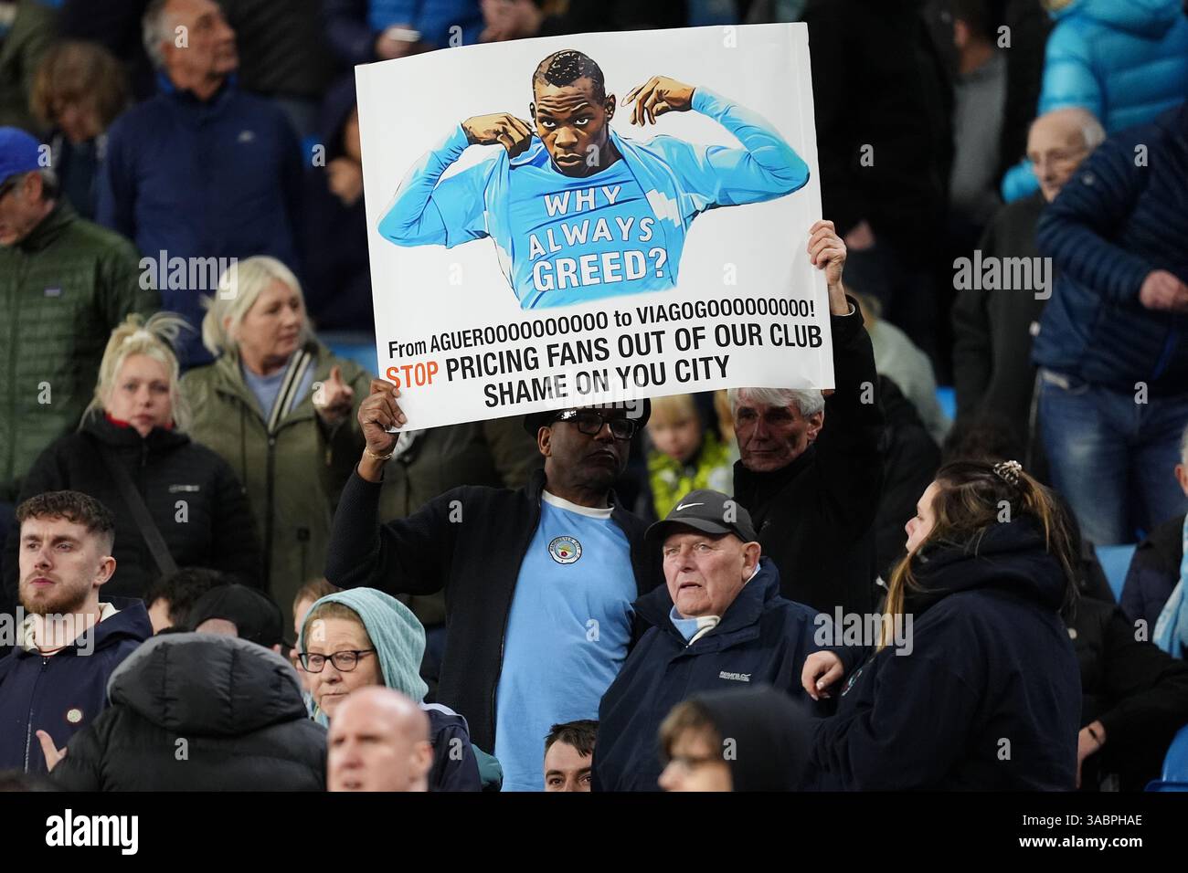 Manchester City supporters hold a sign in protest against ticket ...